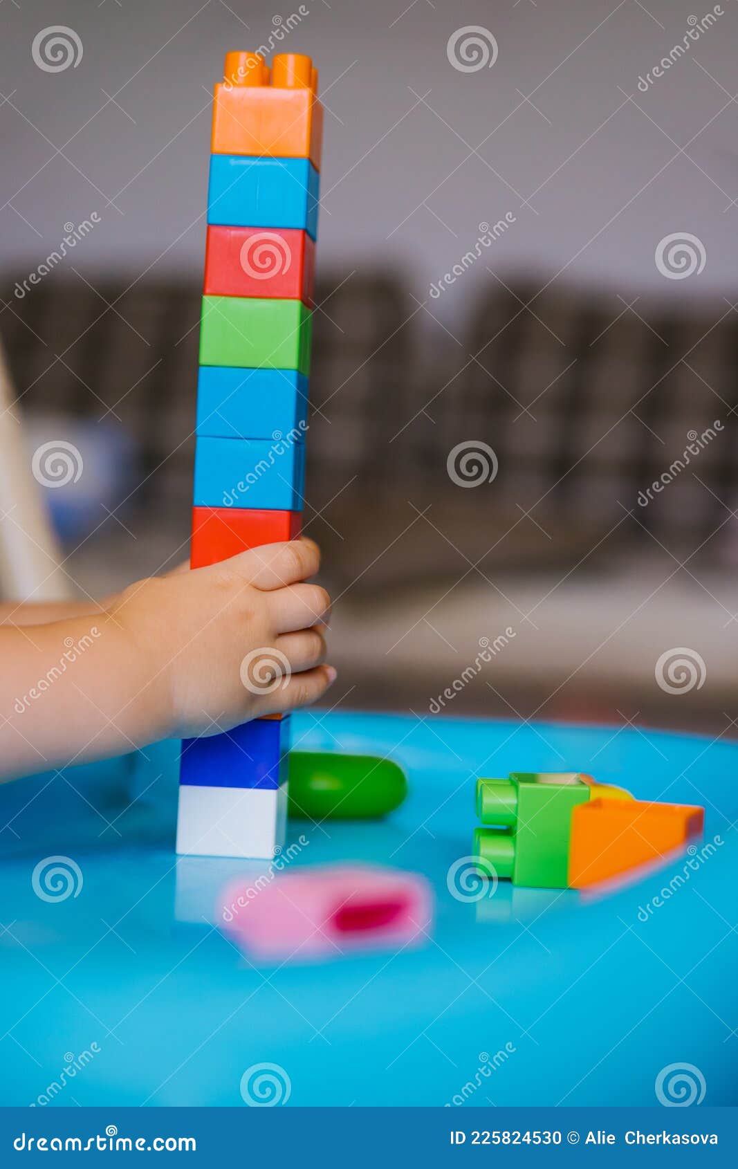 The Child Collects a Multi-colored Constructor. Children`s Classes in ...