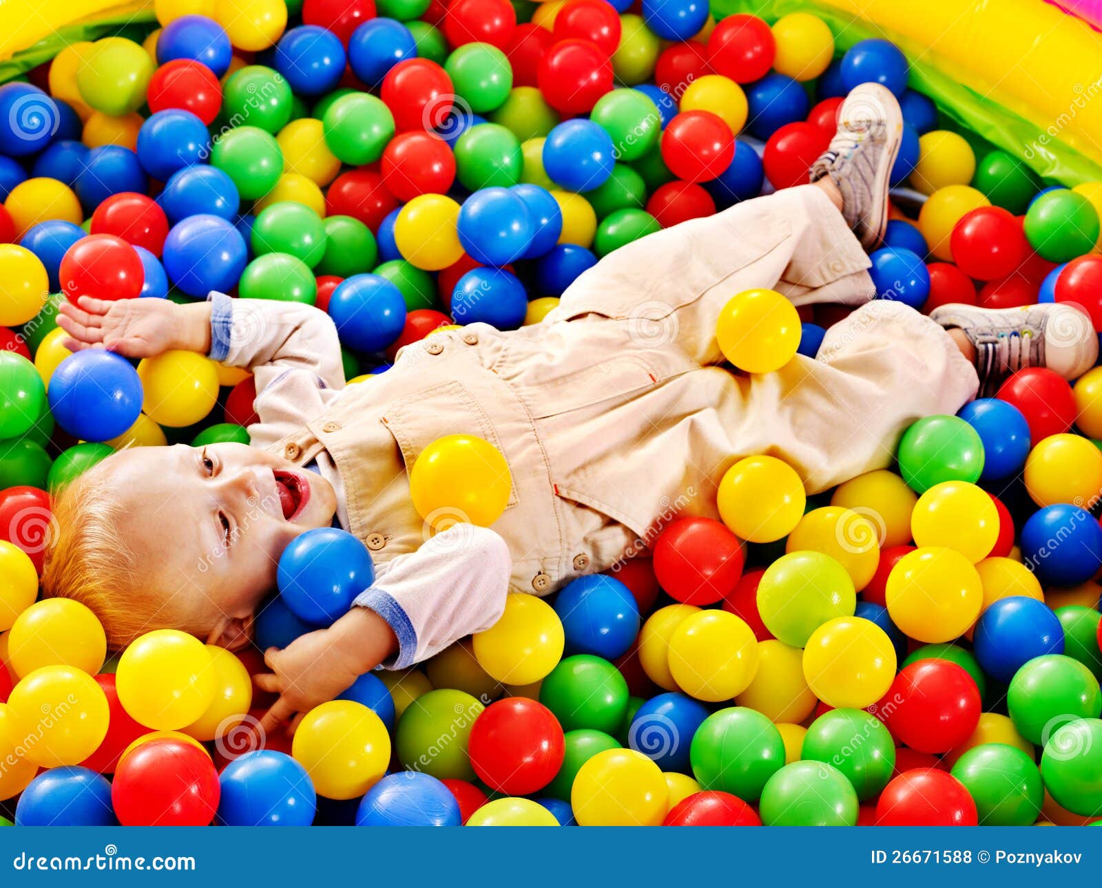 Child in colored ball. stock photo. Image of birthday - 26671588
