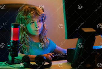 Child with Computer Late at Night. Neon Blue Light. Little Hacker ...