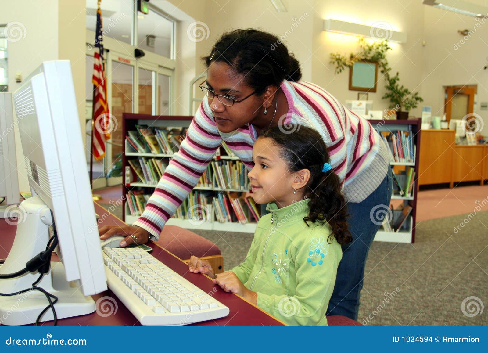 Child on Computer with Teacher Stock Photo - Image of learning, library ...