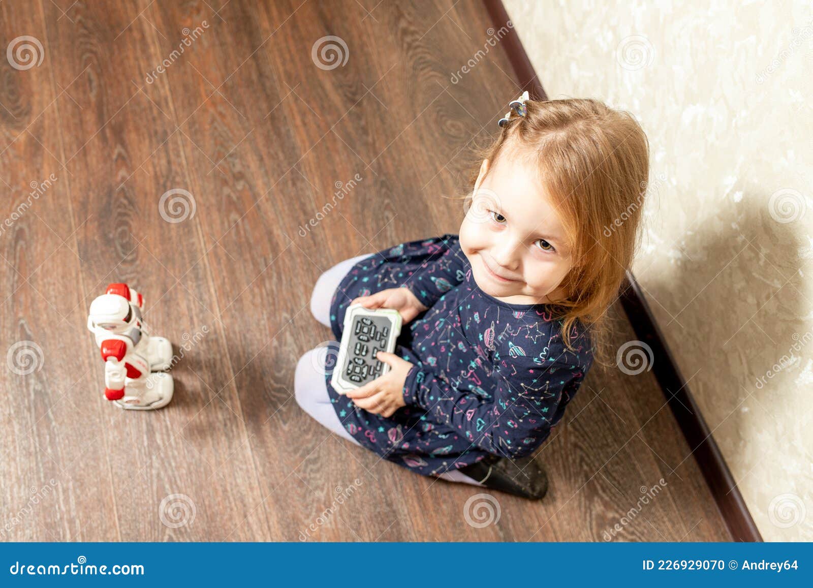Infatuated Child Boy Playing Plastic Toy Lizard Robot With A Remote ...