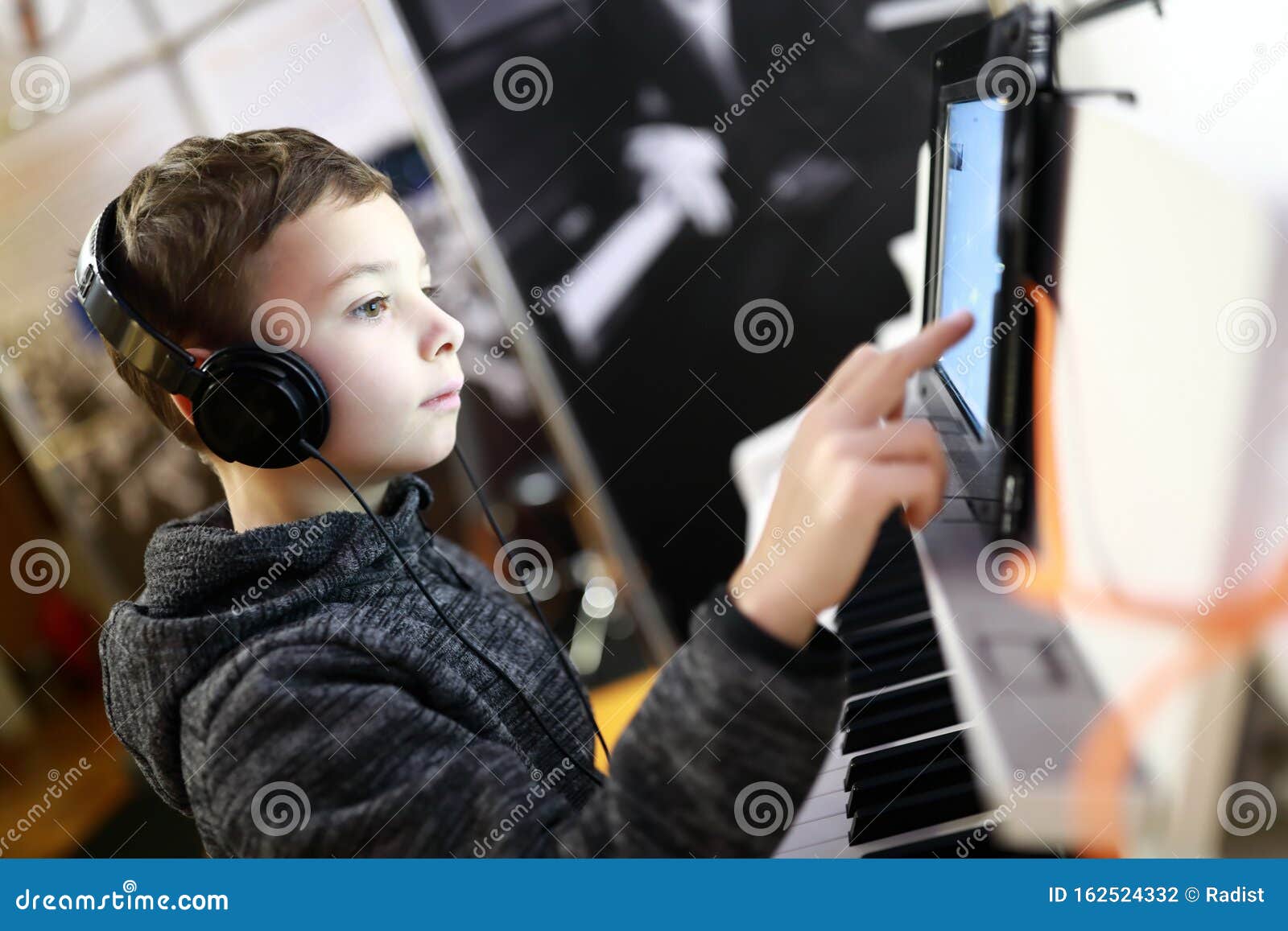 Child controls synthesizer stock photo. Image of keyboard - 162524332