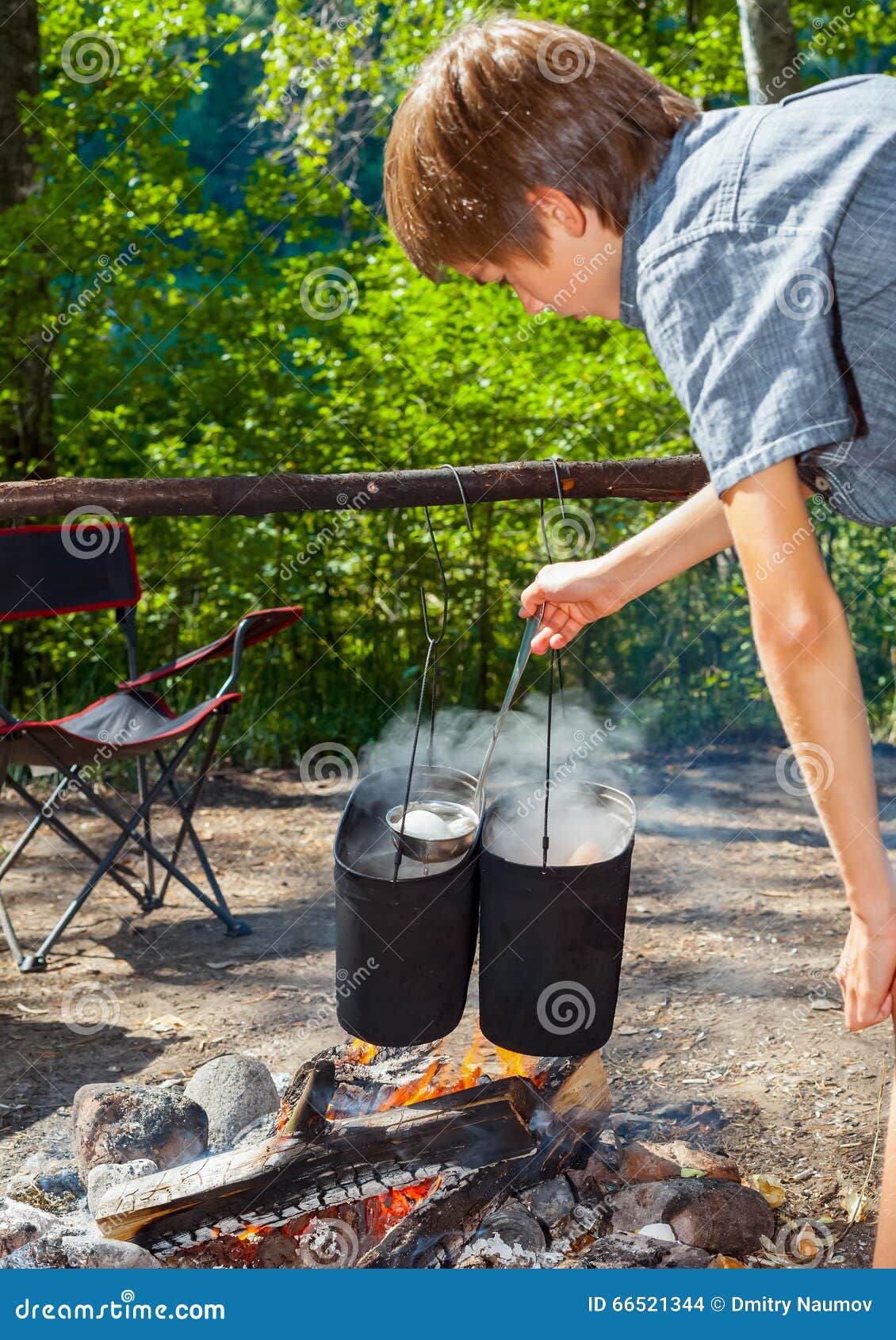 Child cooking on campfire stock photo. Image of kettle - 66521344