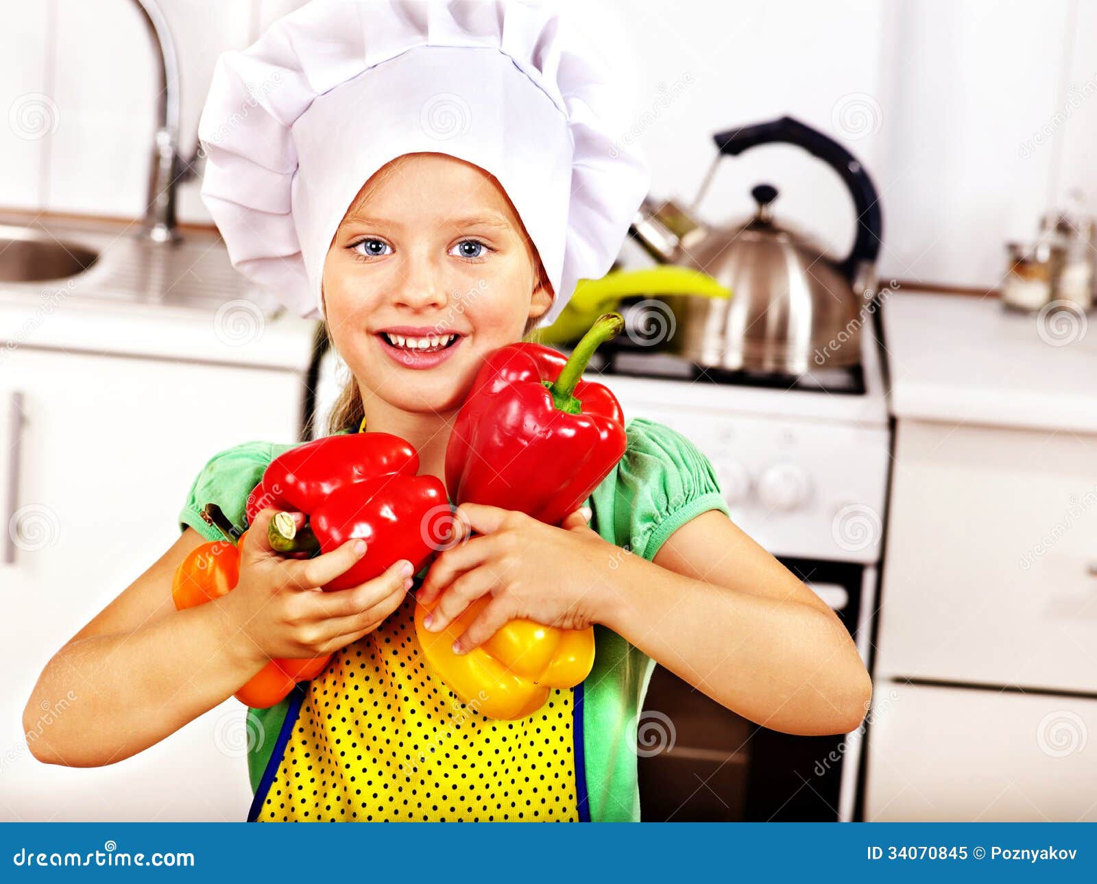 Child cooking at kitchen. stock image. Image of capsicum - 34070845