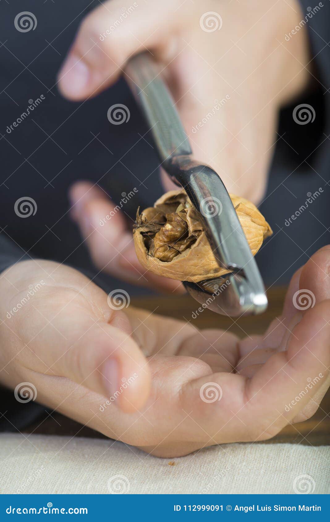 Child cracking walnuts stock image. Image of walnut - 112999091