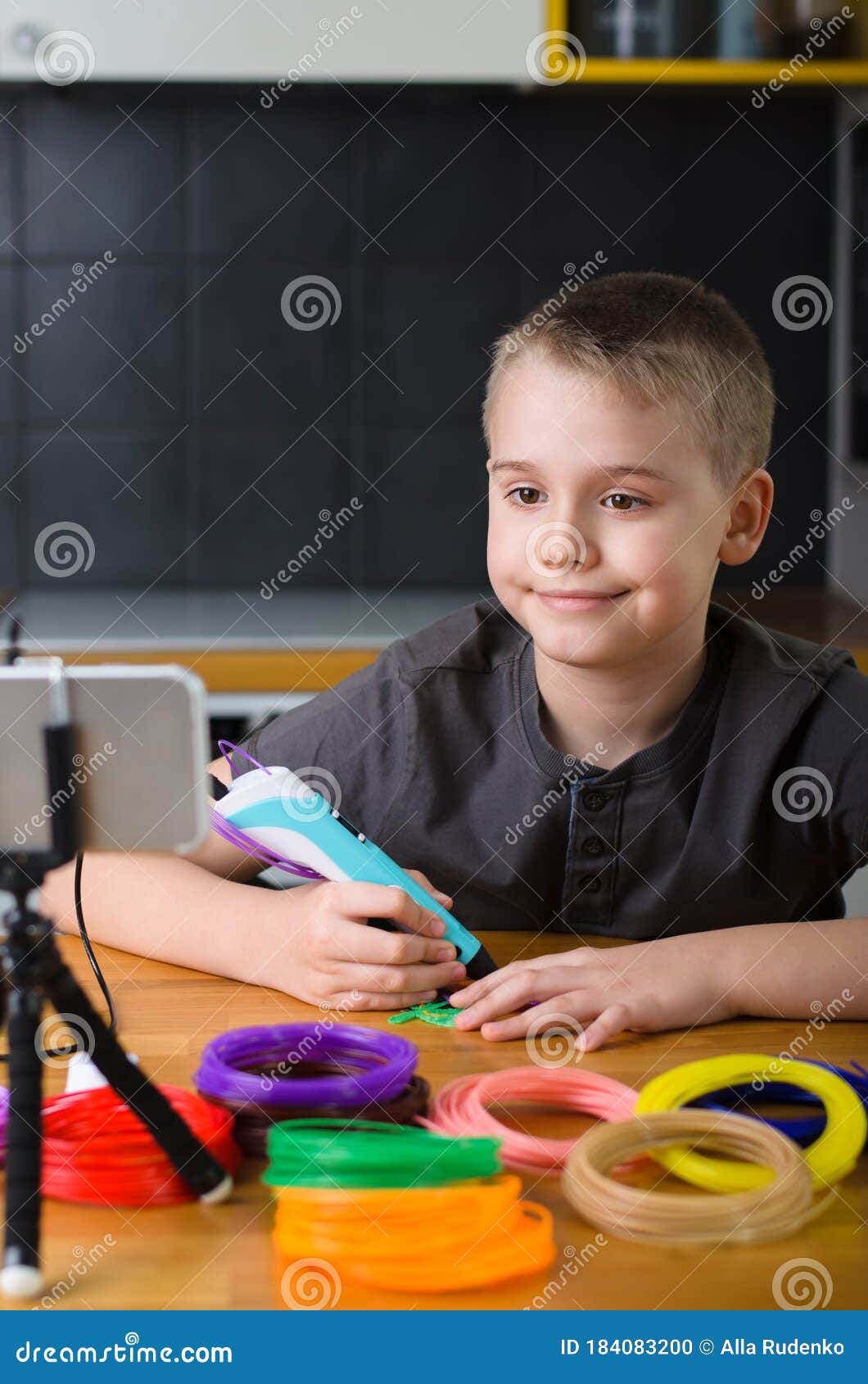 Child Creating with 3d Printing Pen. Happy Boy Does Something with ...