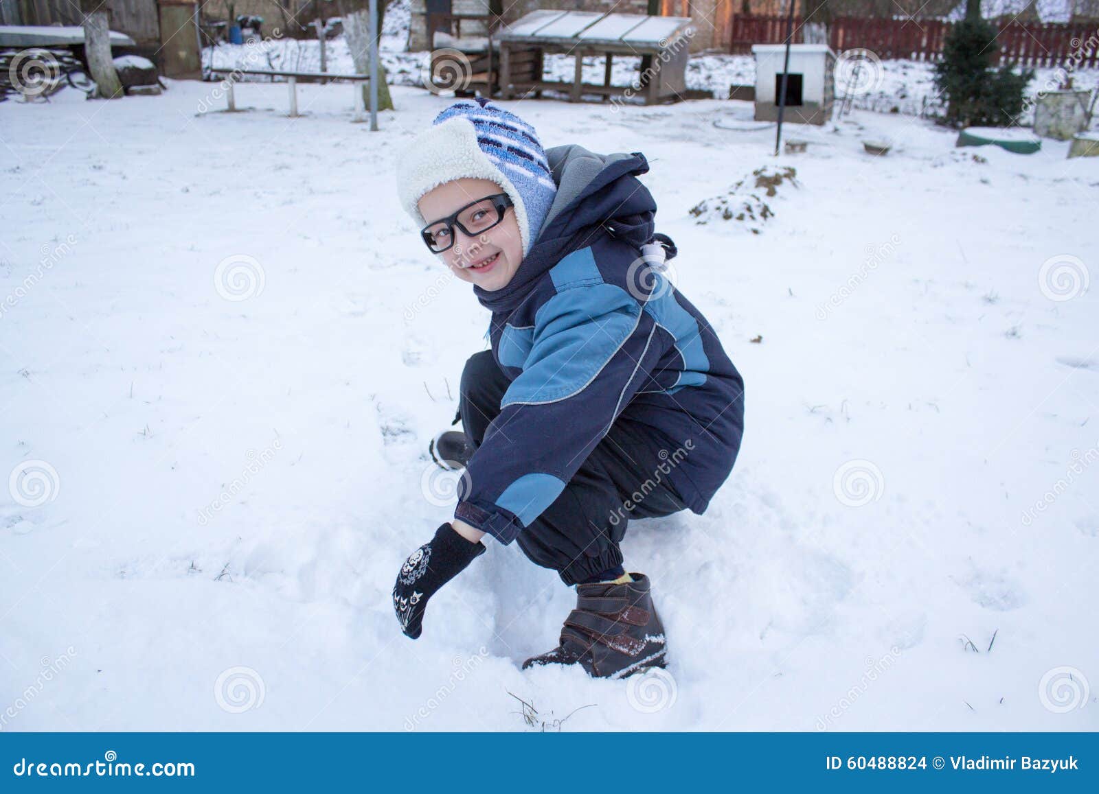 Child crouched in winter stock photo. Image of outdoors - 60488824