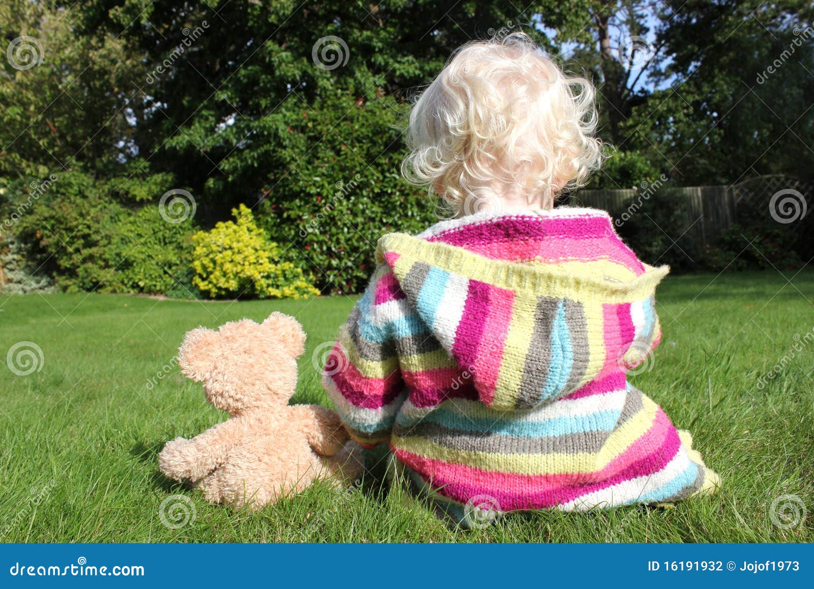 Child cuddling teddy bear stock photo. Image of love - 16191932
