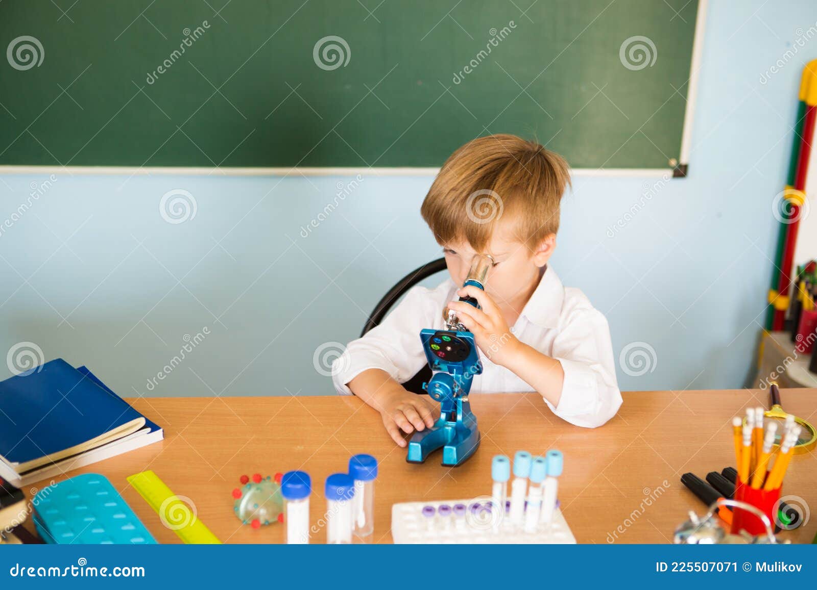 Child with Curiosity during a Medicine Fair Looking at Bacteria through ...