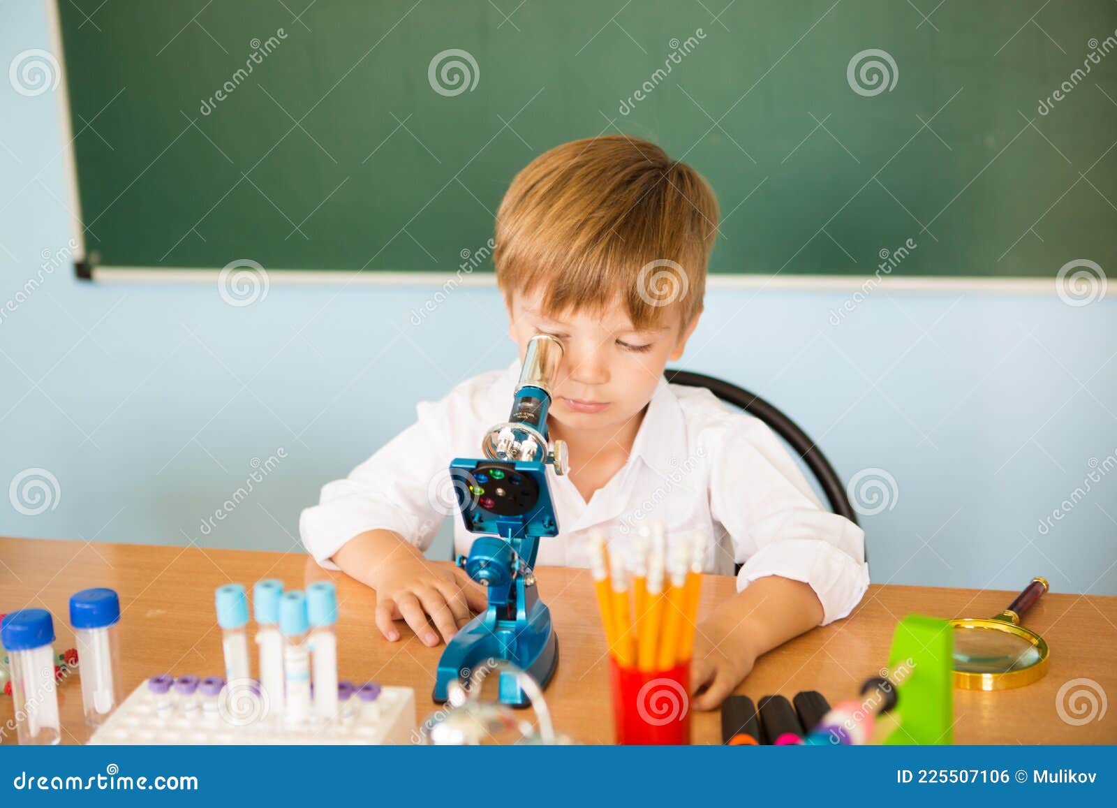 Child with Curiosity during a Medicine Fair Looking at Bacteria through ...