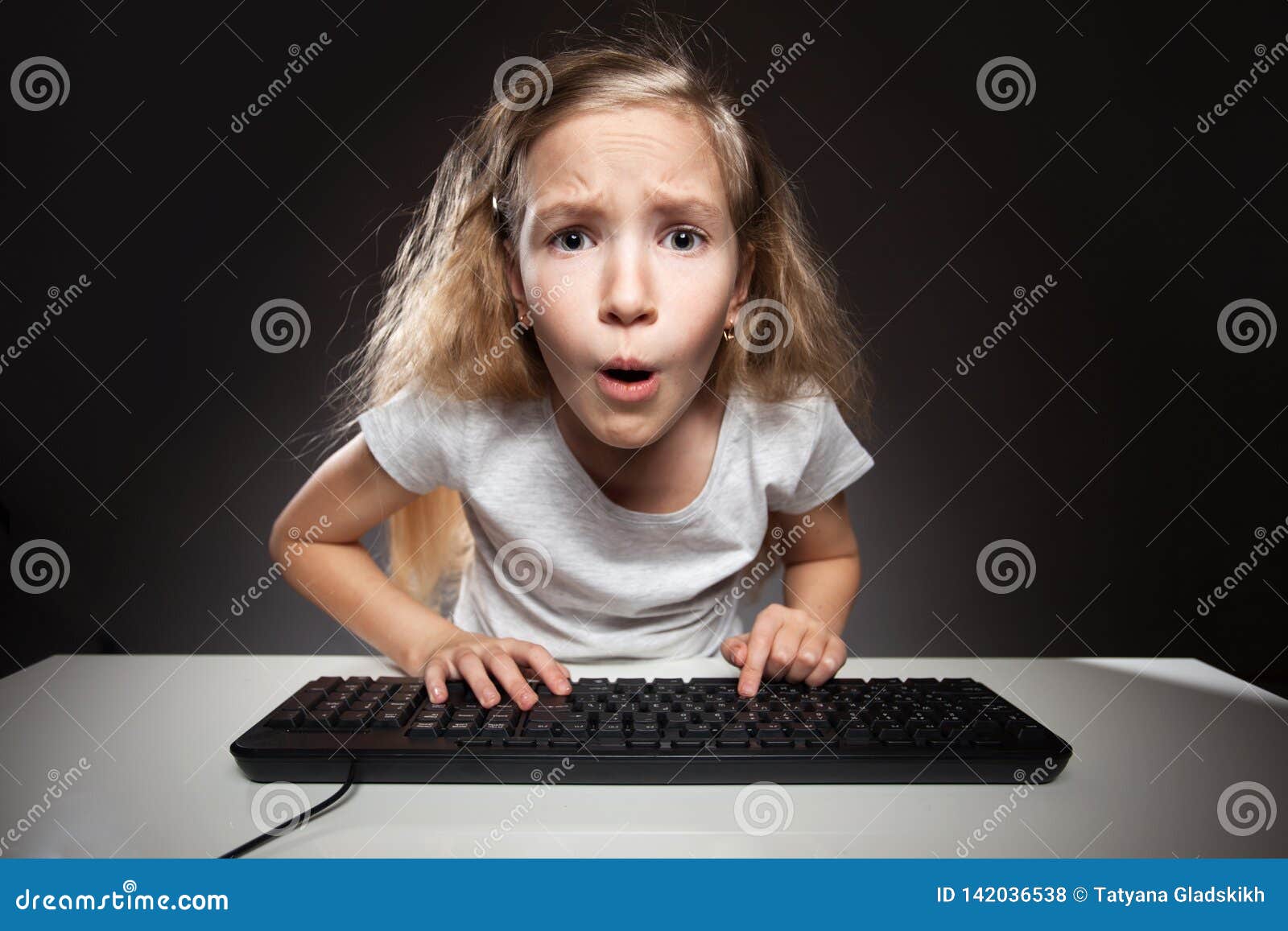 Child Curiously Looking into the Computer Stock Photo - Image of shock ...