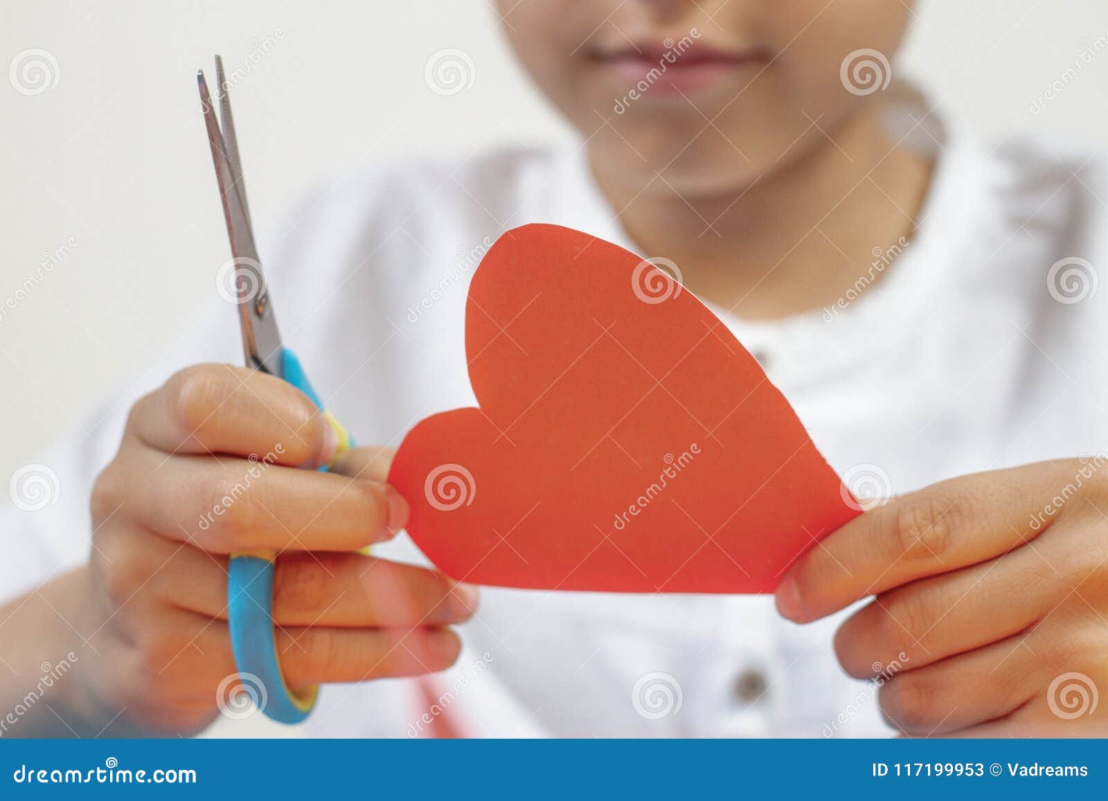 Child Hand Cutting Red Paper Heart with Scissors. Stock Image - Image ...