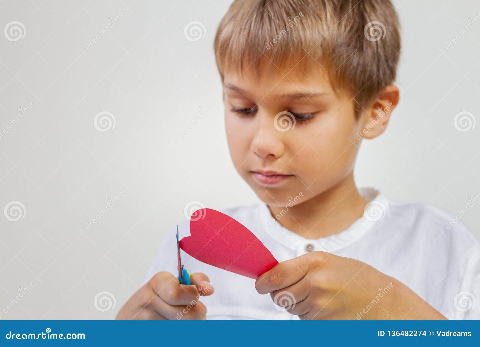 Child Cutting Red Paper Heart with Scissors Stock Photo - Image of ...