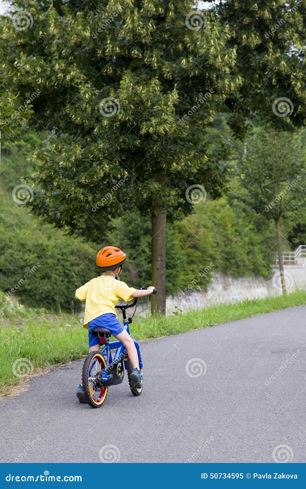 Child cycling on a path stock image. Image of park, nature - 50734595