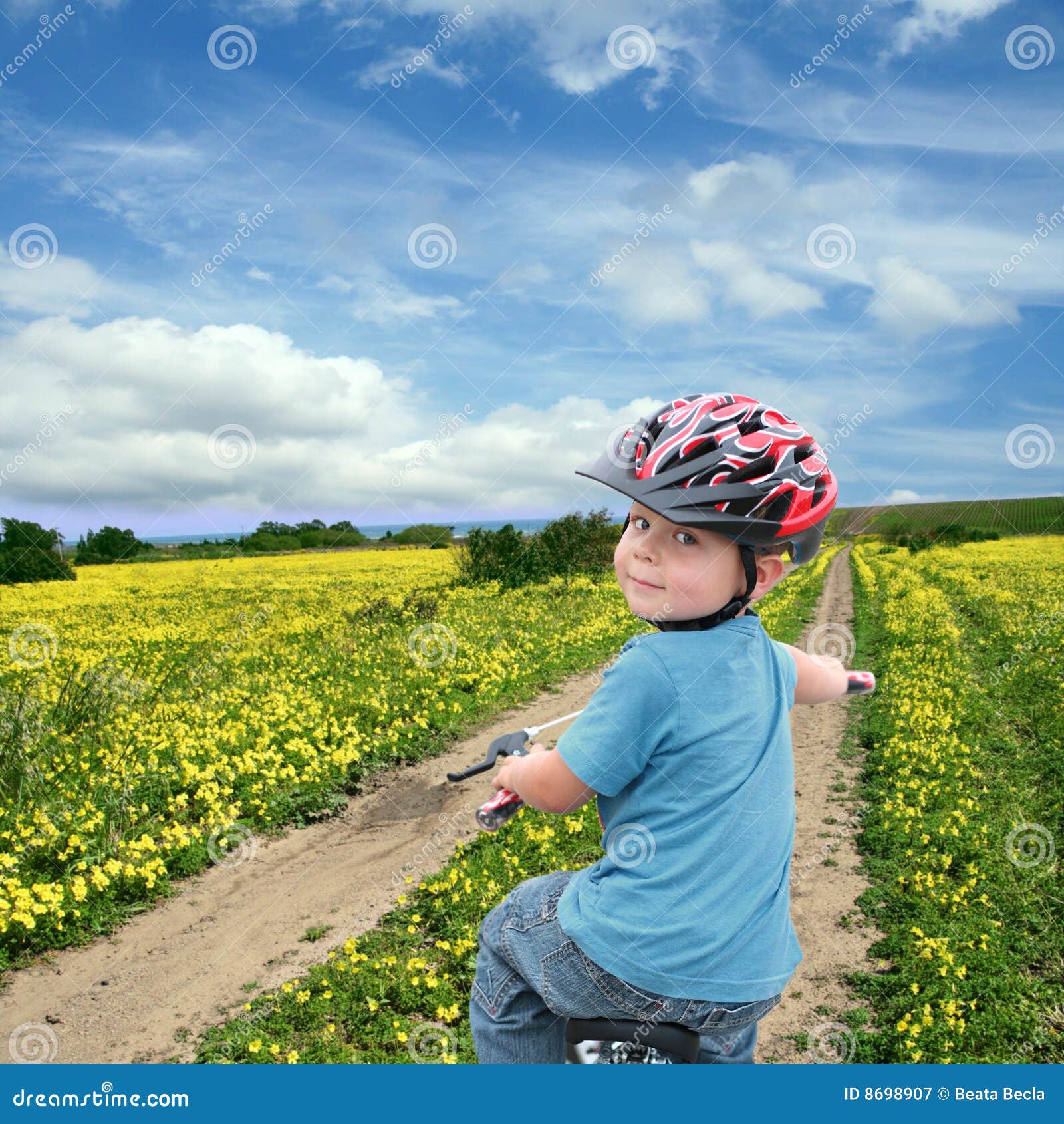 Child Cycling on a Spring Meadow Stock Image - Image of biking, helmet ...