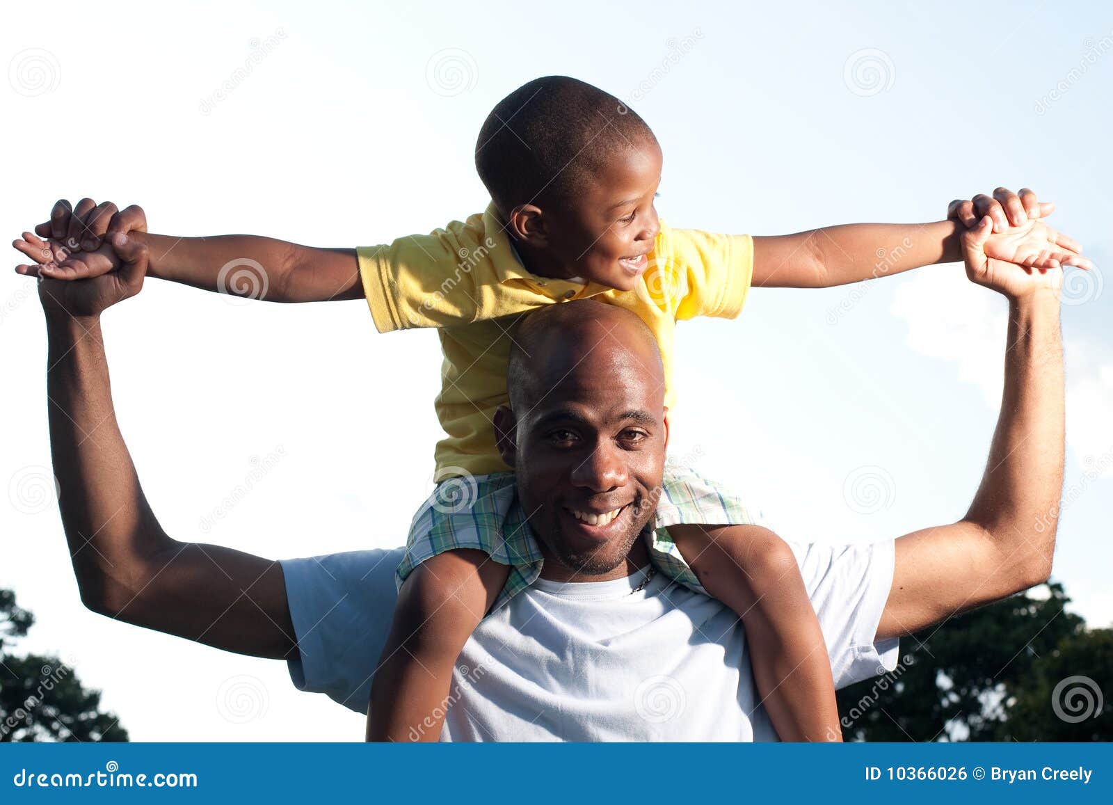 Child on dad s shoulders stock photo. Image of child - 10366026