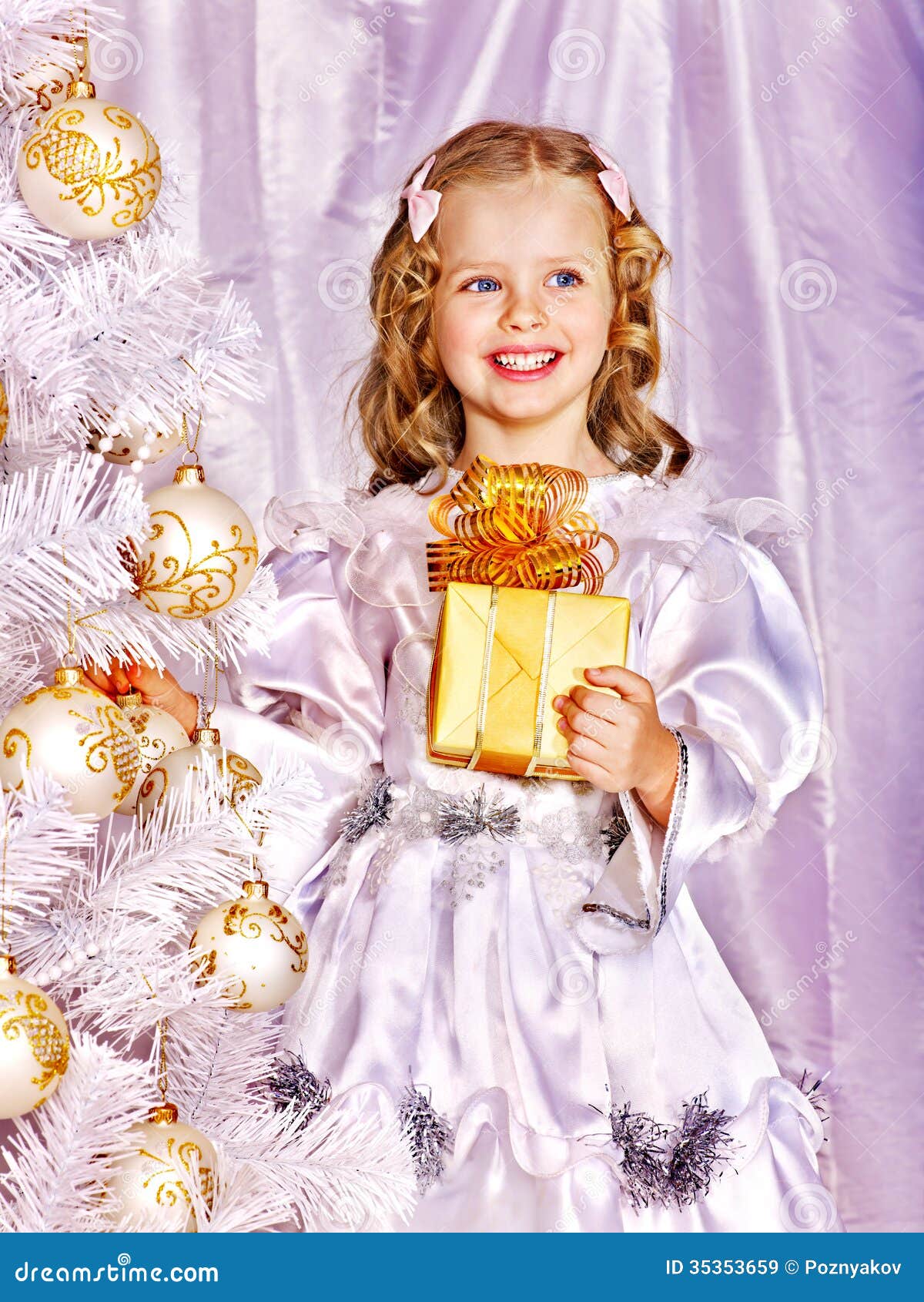 Child Decorate The Christmas Tree With Balls And Ladder At Home Stock ...