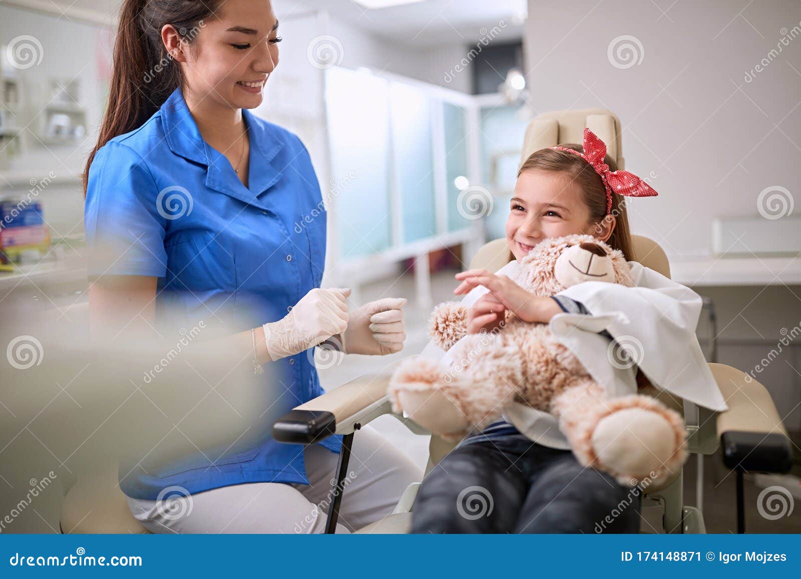 Child at Dentist Hugging Teddy Bear Stock Image - Image of equipment ...
