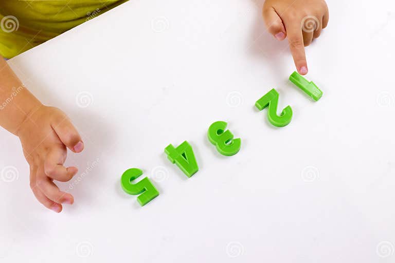 Child Development. Counting Training. the Child Points To the Numbers ...