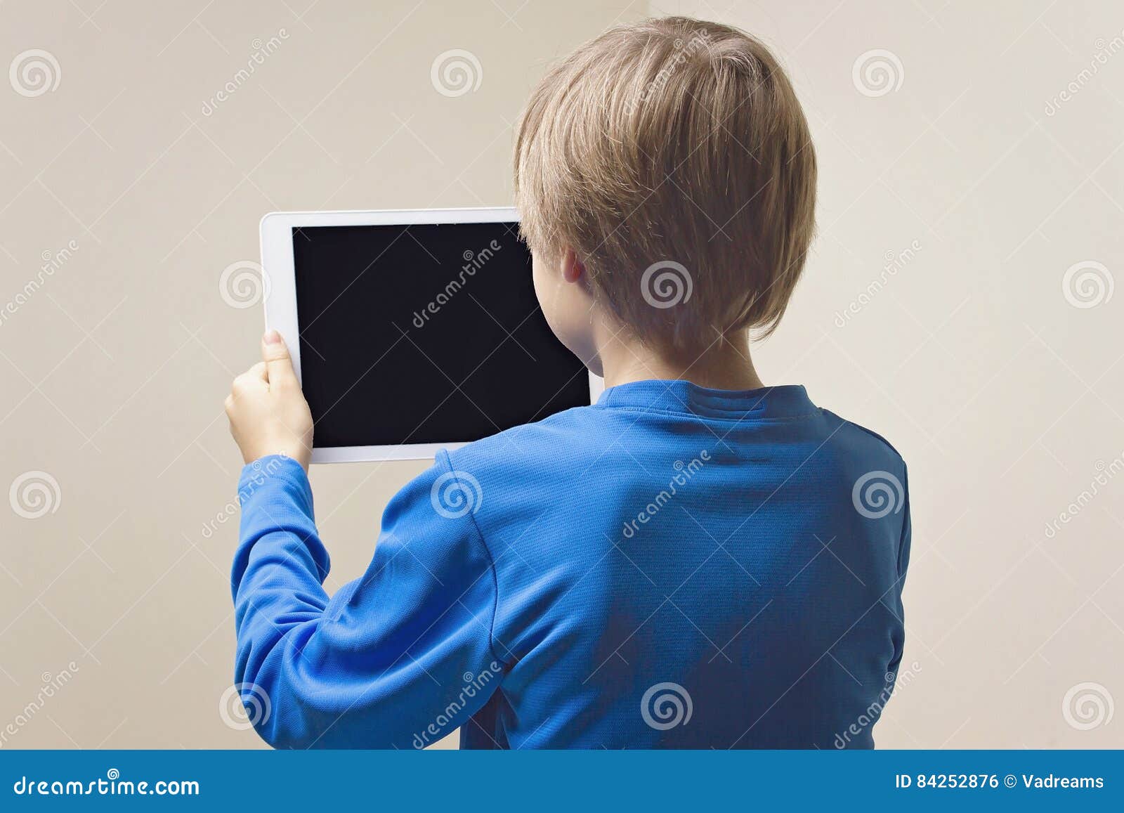 Child with Digital Tablet Computer. Back View Stock Photo - Image of ...