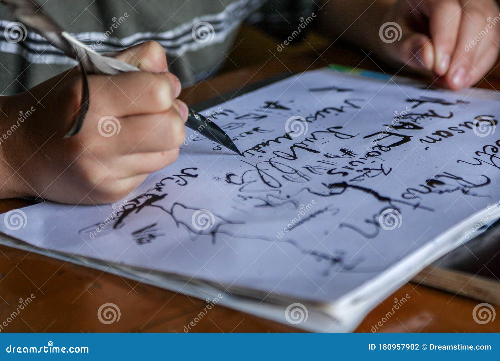 A Child Doing Calligraphy Writing Stock Photo - Image of guestbook ...