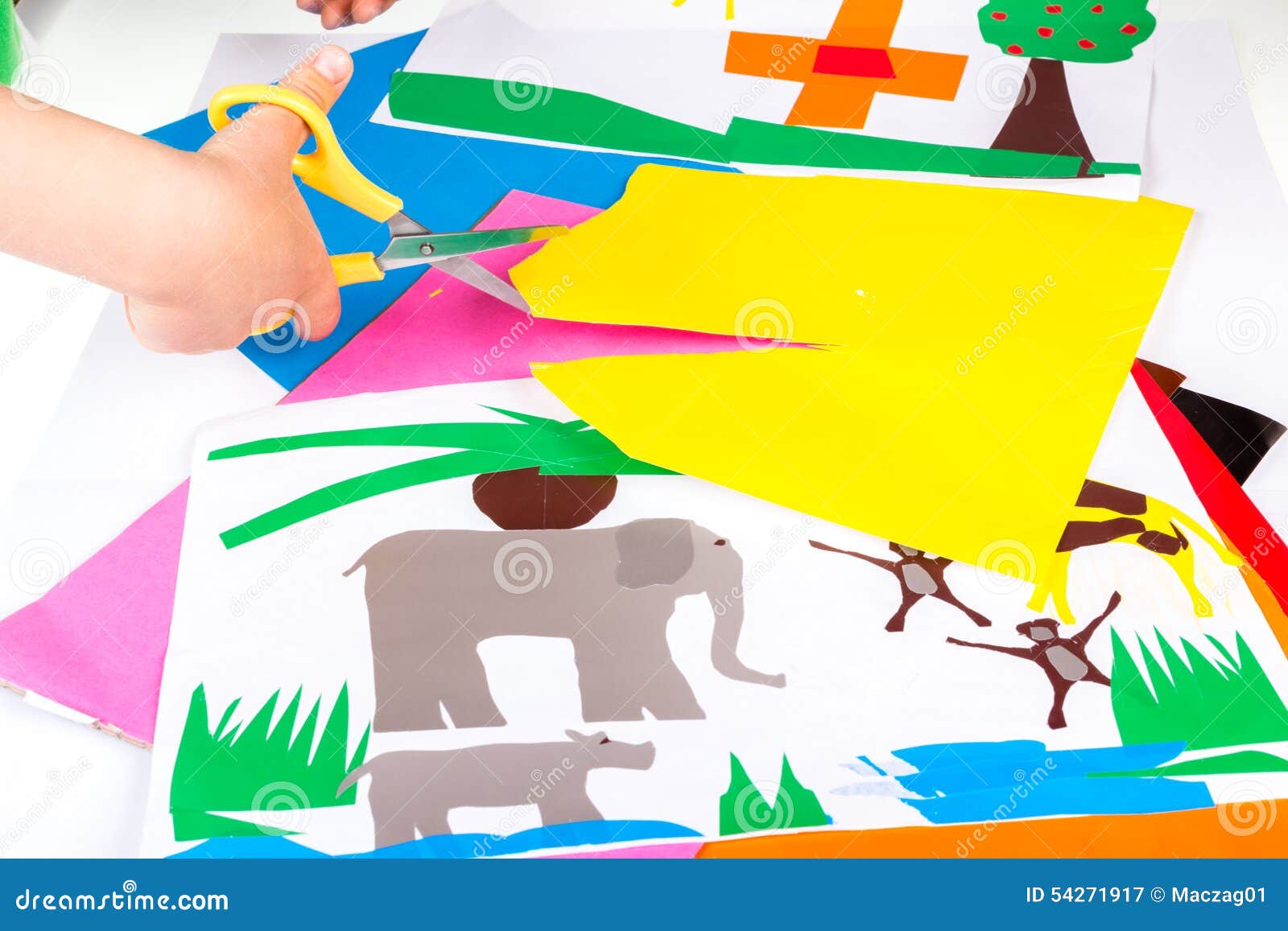 Child doing cutouts stock image. Image of background - 54271917