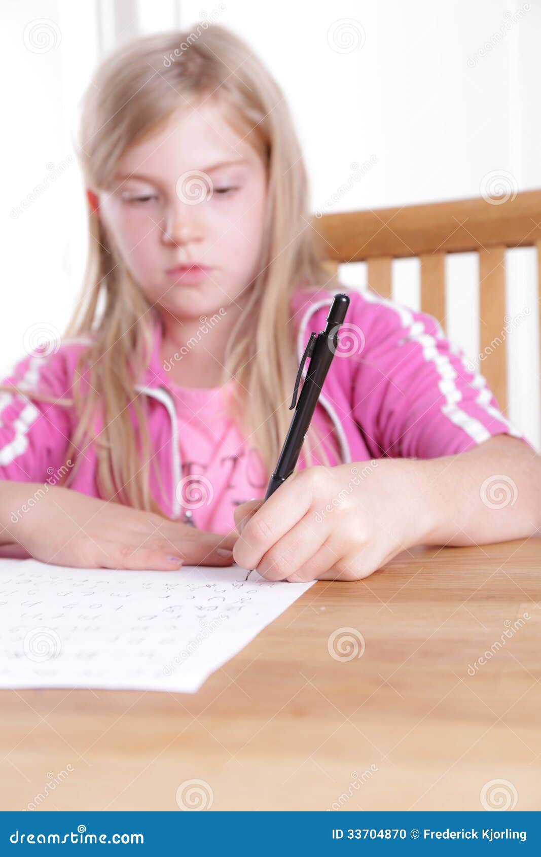 Child doing her homework stock photo. Image of girl, sitting - 33704870