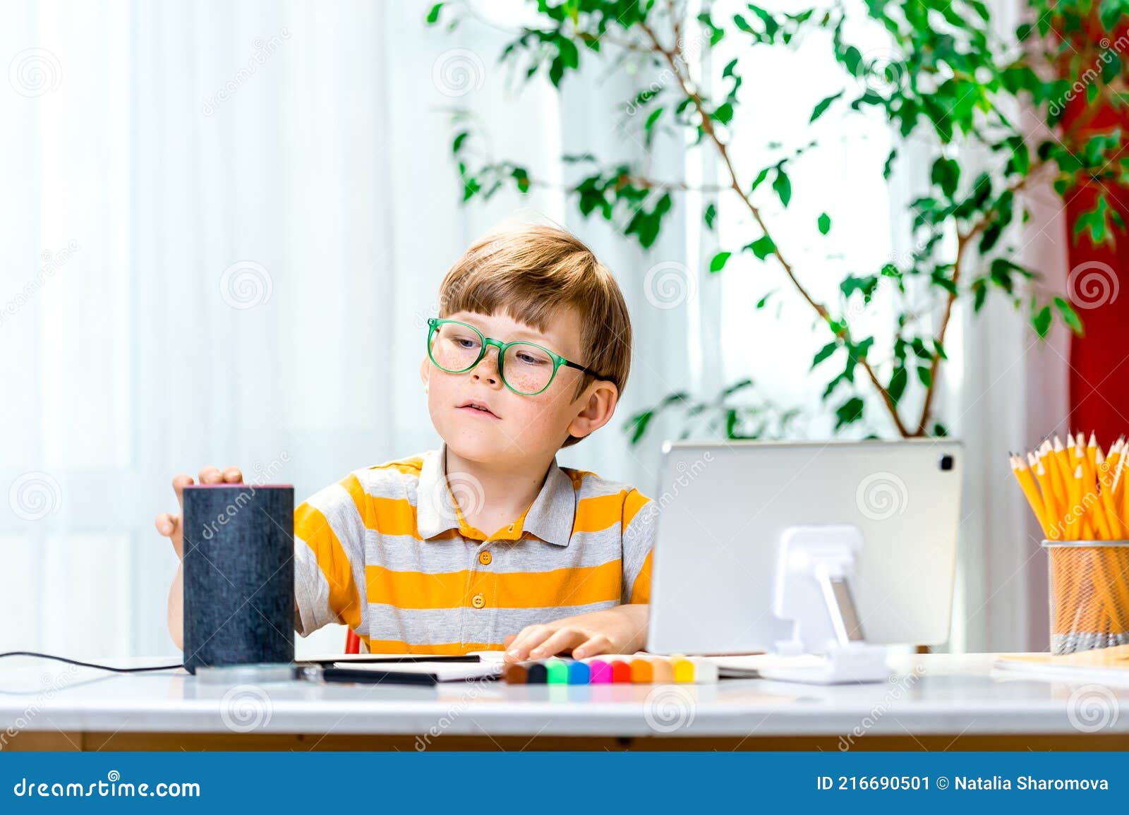 Child Doing Homework and Using Smart Speaker and Voice Assistant ...