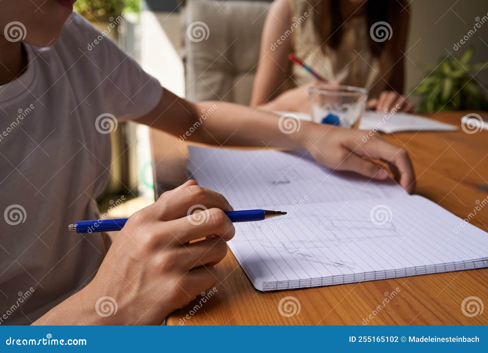 Child Drawing into an Exercise Book, Doing Homework Stock Photo - Image ...