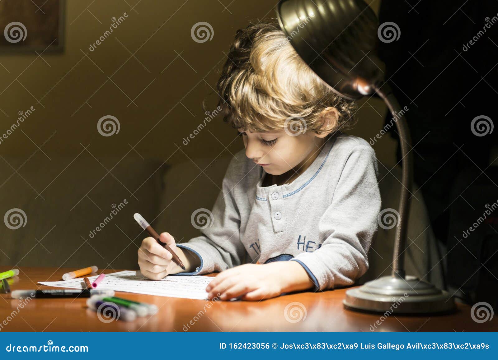 Child Drawing Illuminated by the Light of a Lamp Stock Photo - Image of ...