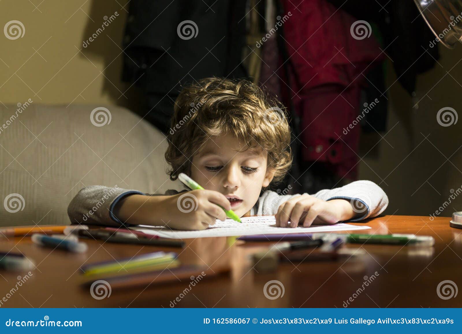Child Drawing Illuminated by the Light of a Lamp Stock Image - Image of ...