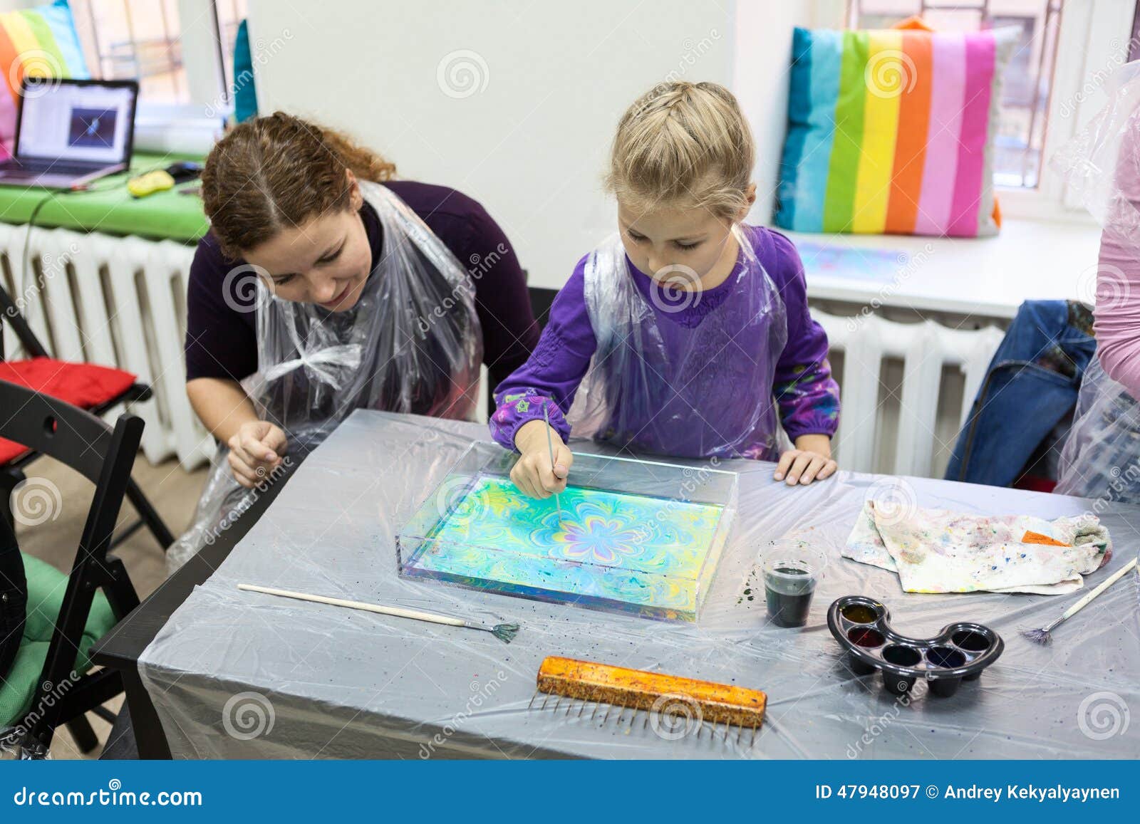 Child Drawing with Needle on the Water. Ebru Art is Method of Aqueous ...