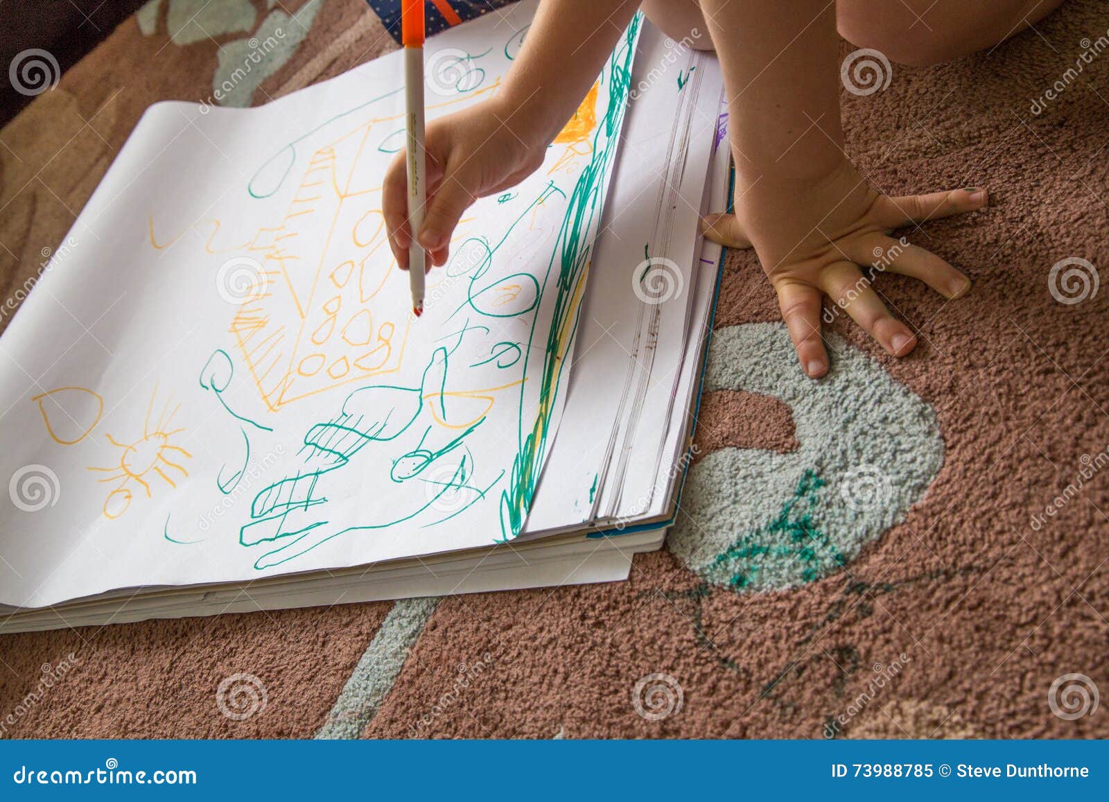 Child Drawing on Paper Pad stock image. Image of colouring - 73988785