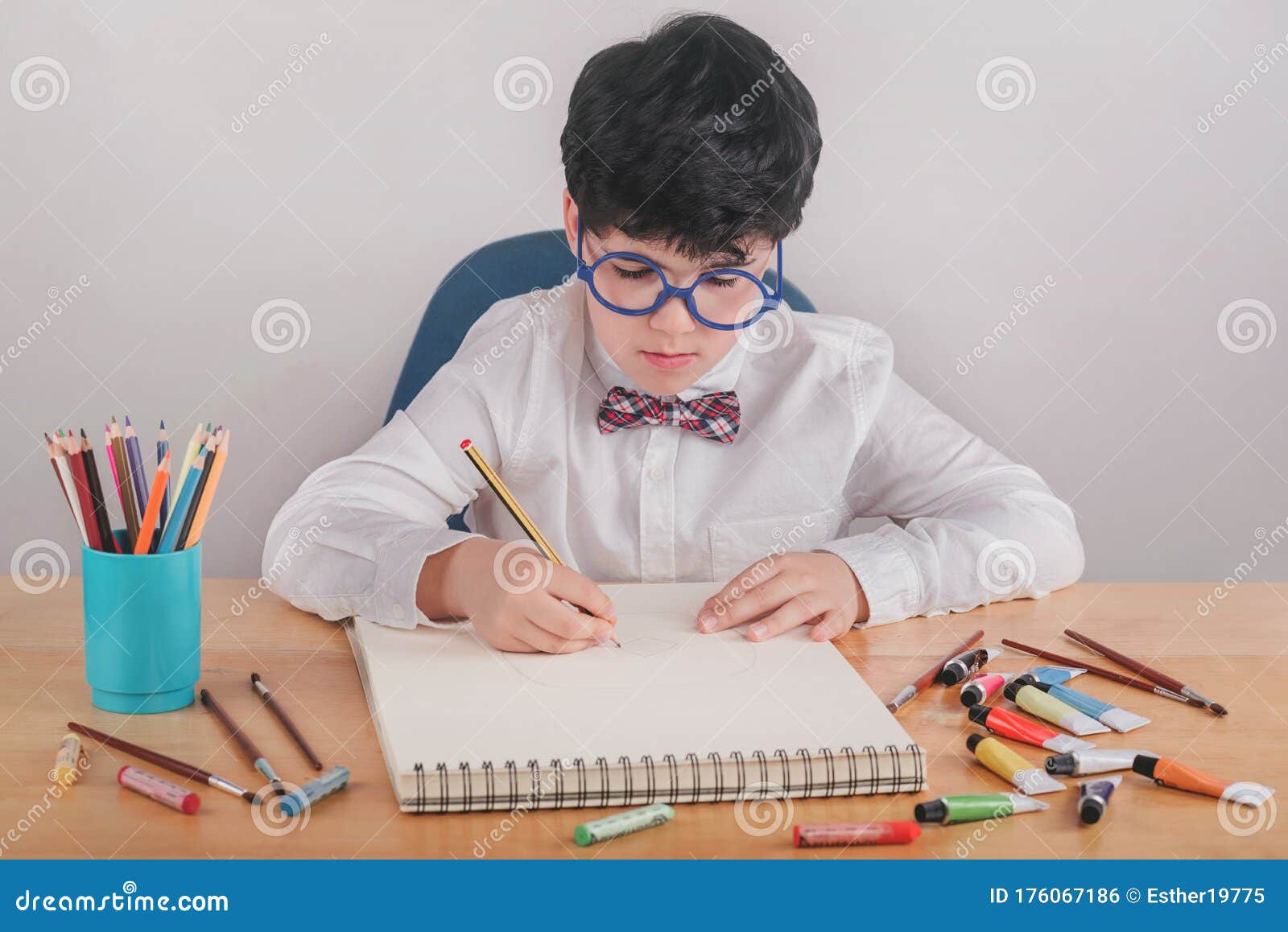 Child drawing on a table stock photo. Image of design - 176067186