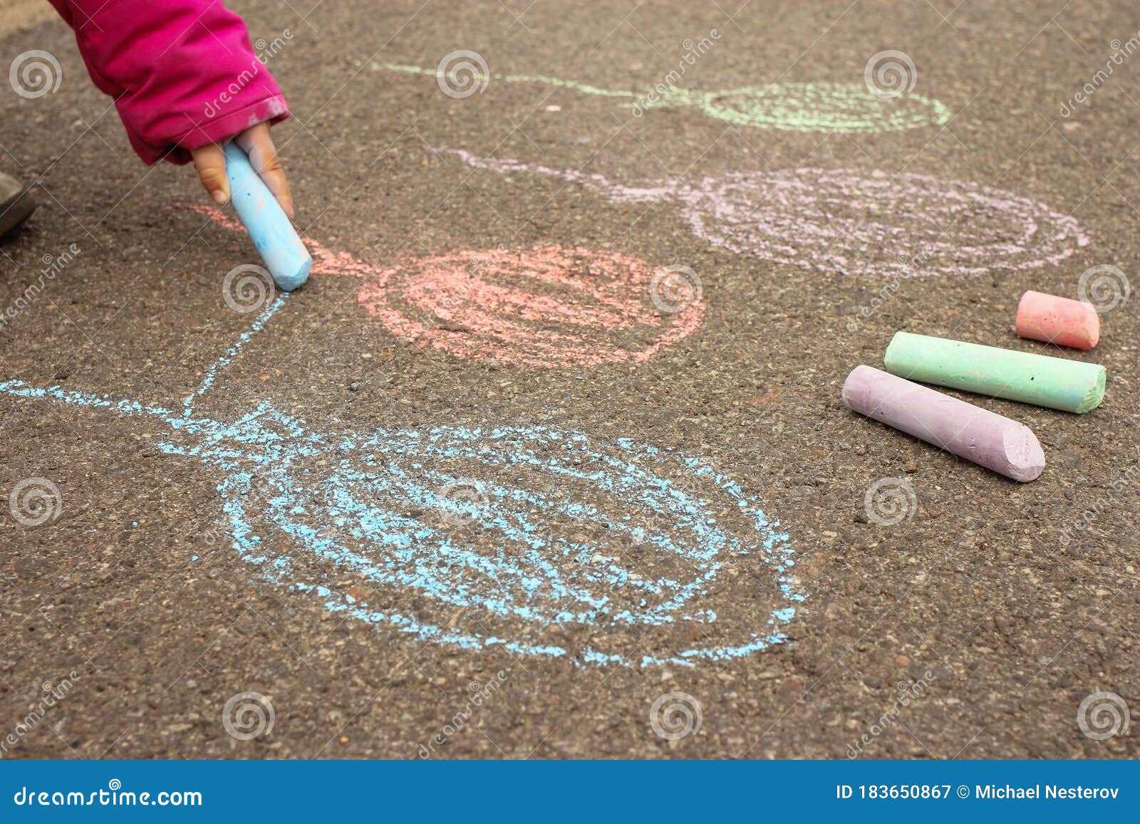 Child Draws Colored Balloons with Chalk, Crayons on the Pavement Stock ...