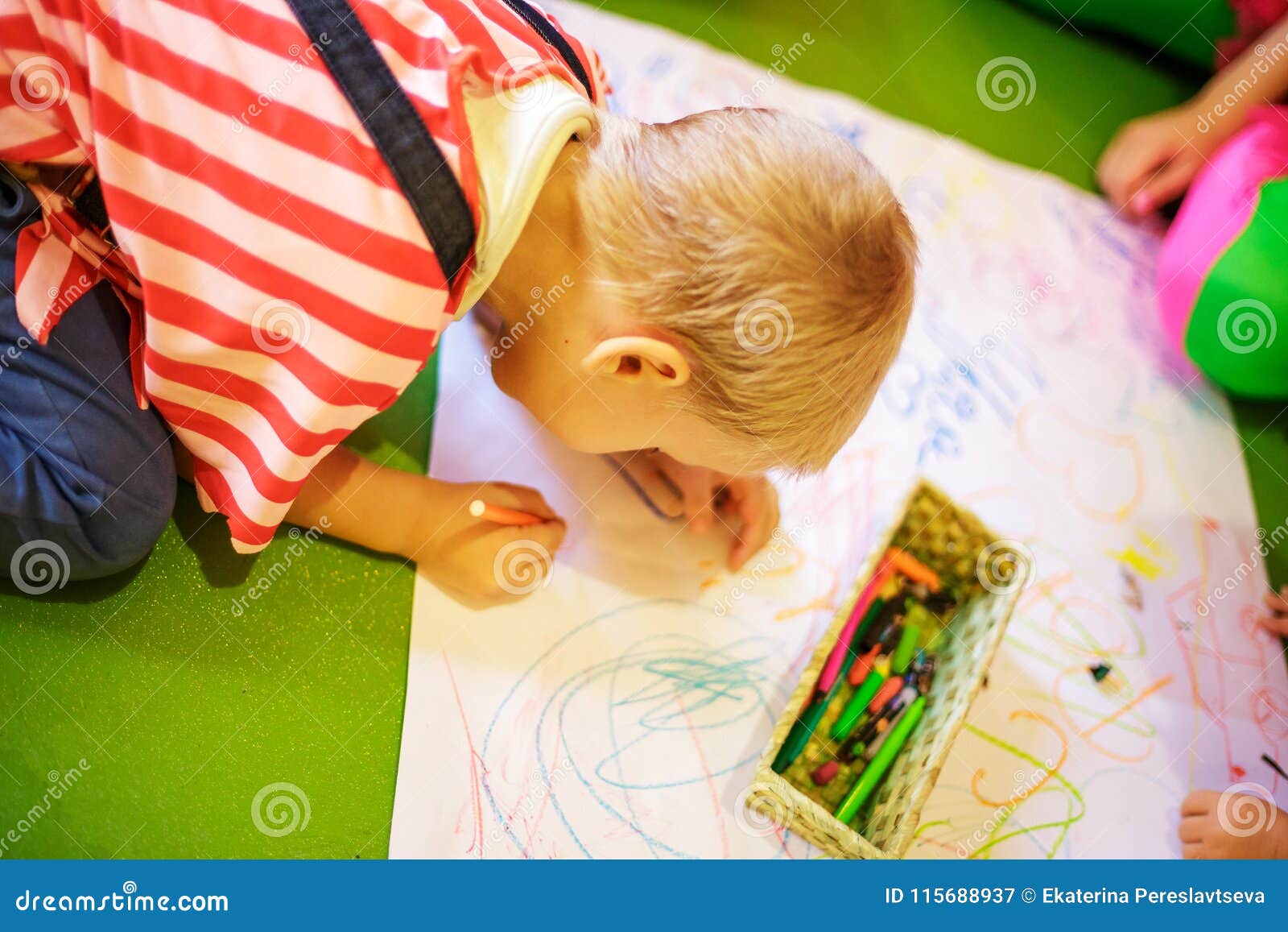 A Child Draws with Crayons on Paper Stock Image - Image of crayon ...