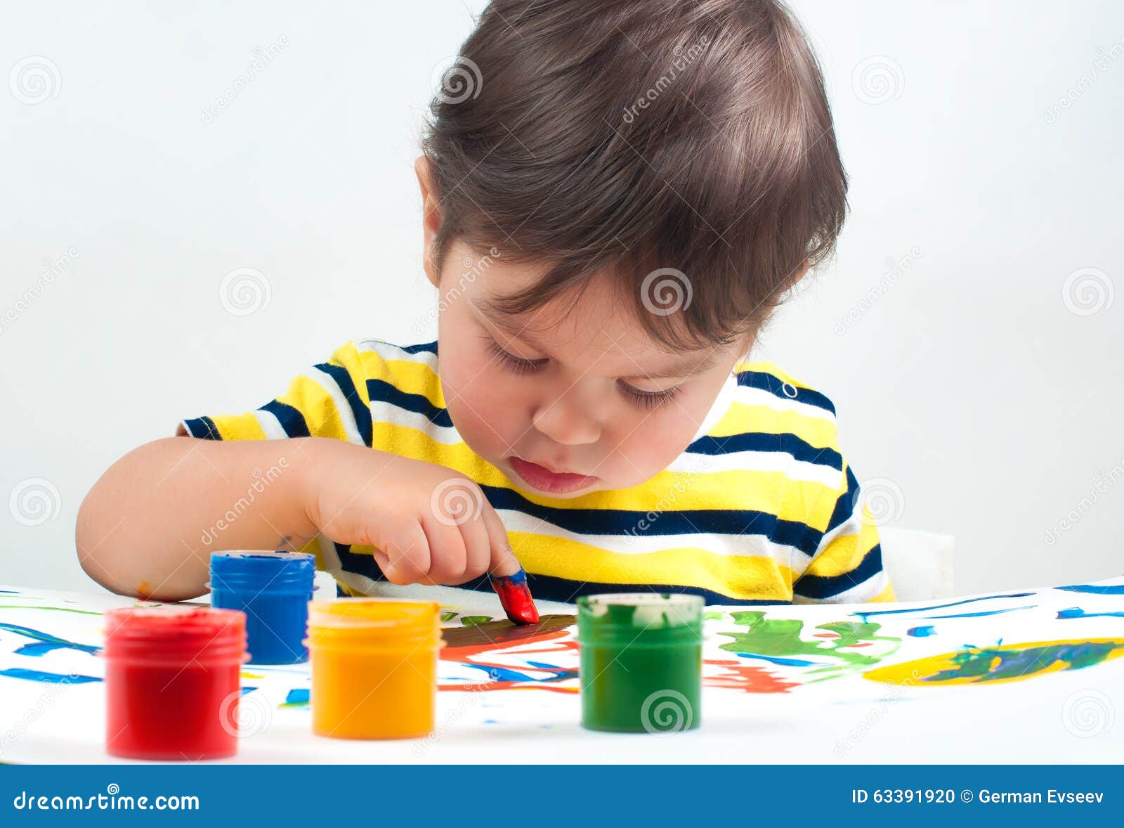 Child draws ink on paper stock photo. Image of paper - 63391920