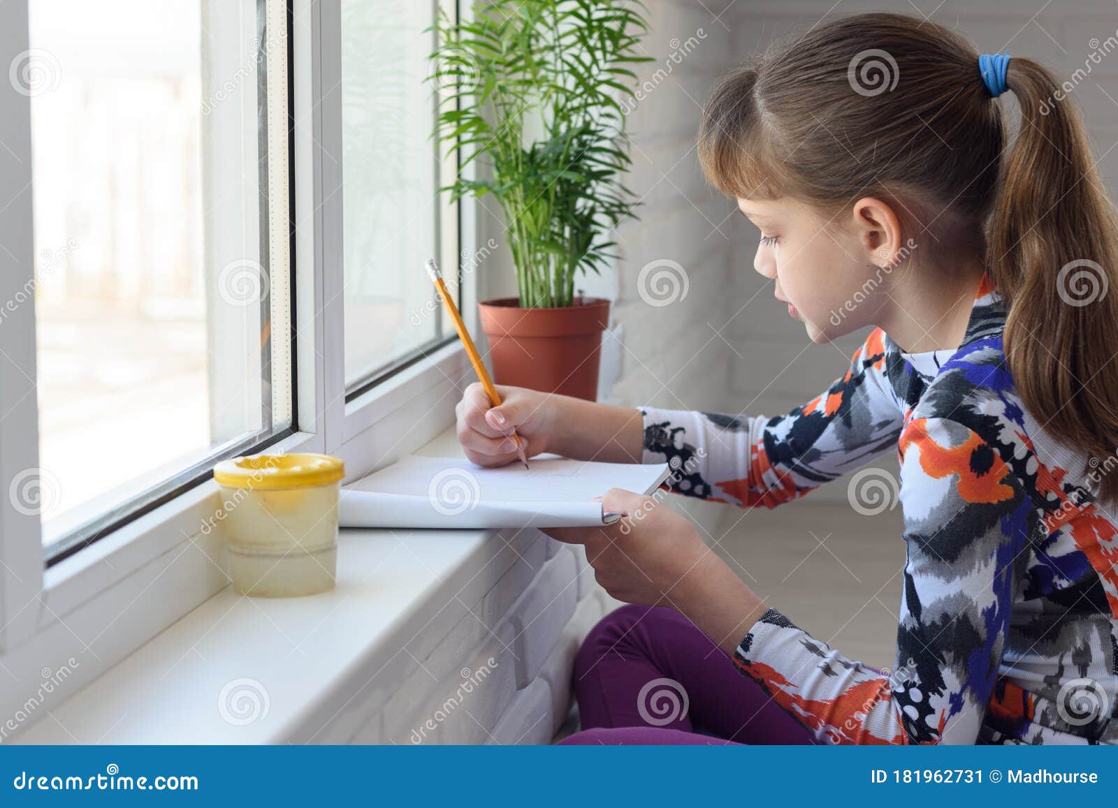 The Child Draws with a Pencil on the Windowsill at Home Stock Image ...