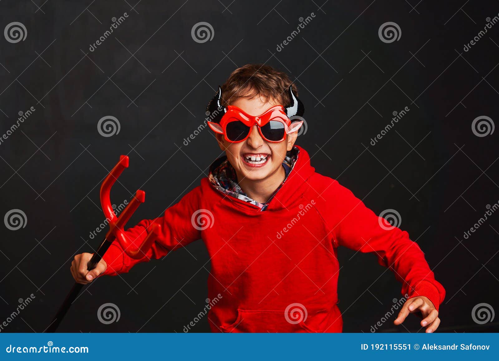 Child Dressed in Devil Costume with Red Pitchfork in His Hands in Image ...