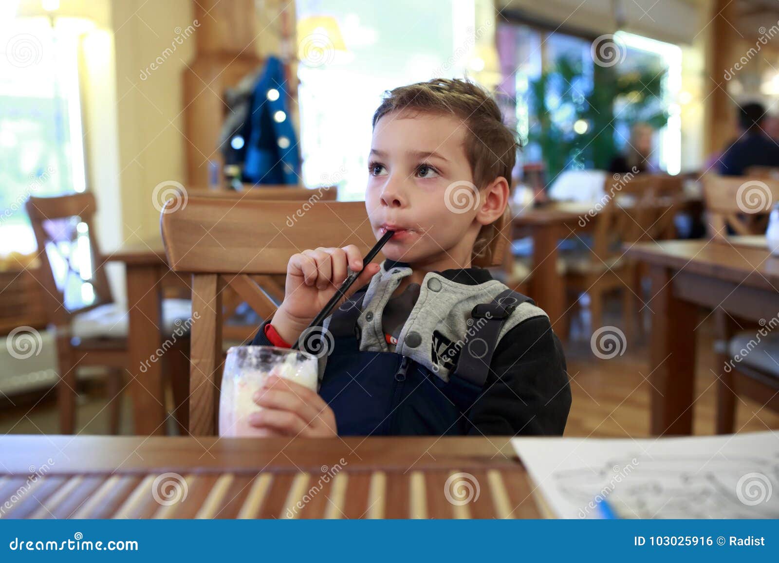 Child drinking milkshake stock photo. Image of attractive - 103025916
