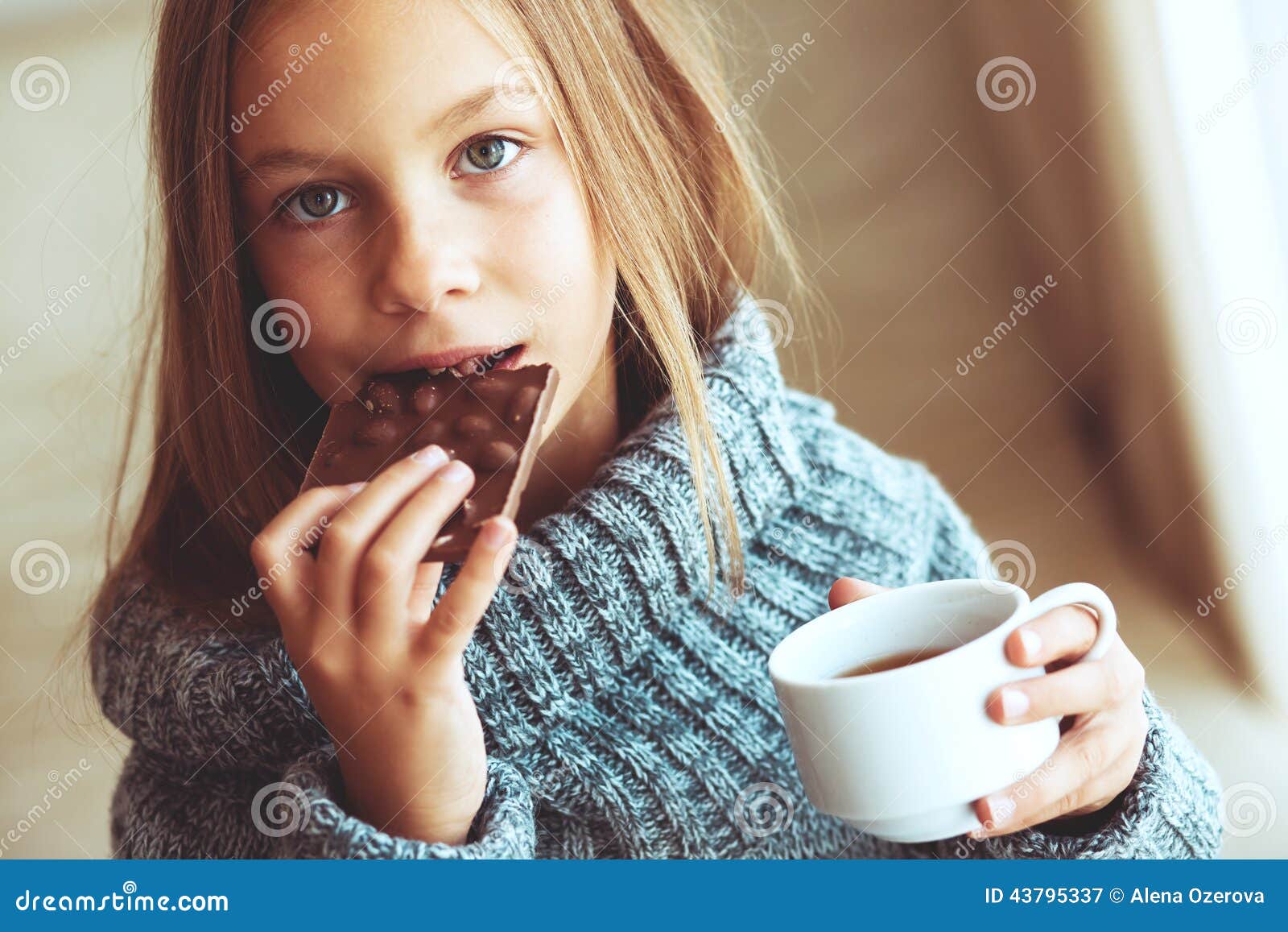 Child drinking tea stock image. Image of chocolate, knitted - 43795337