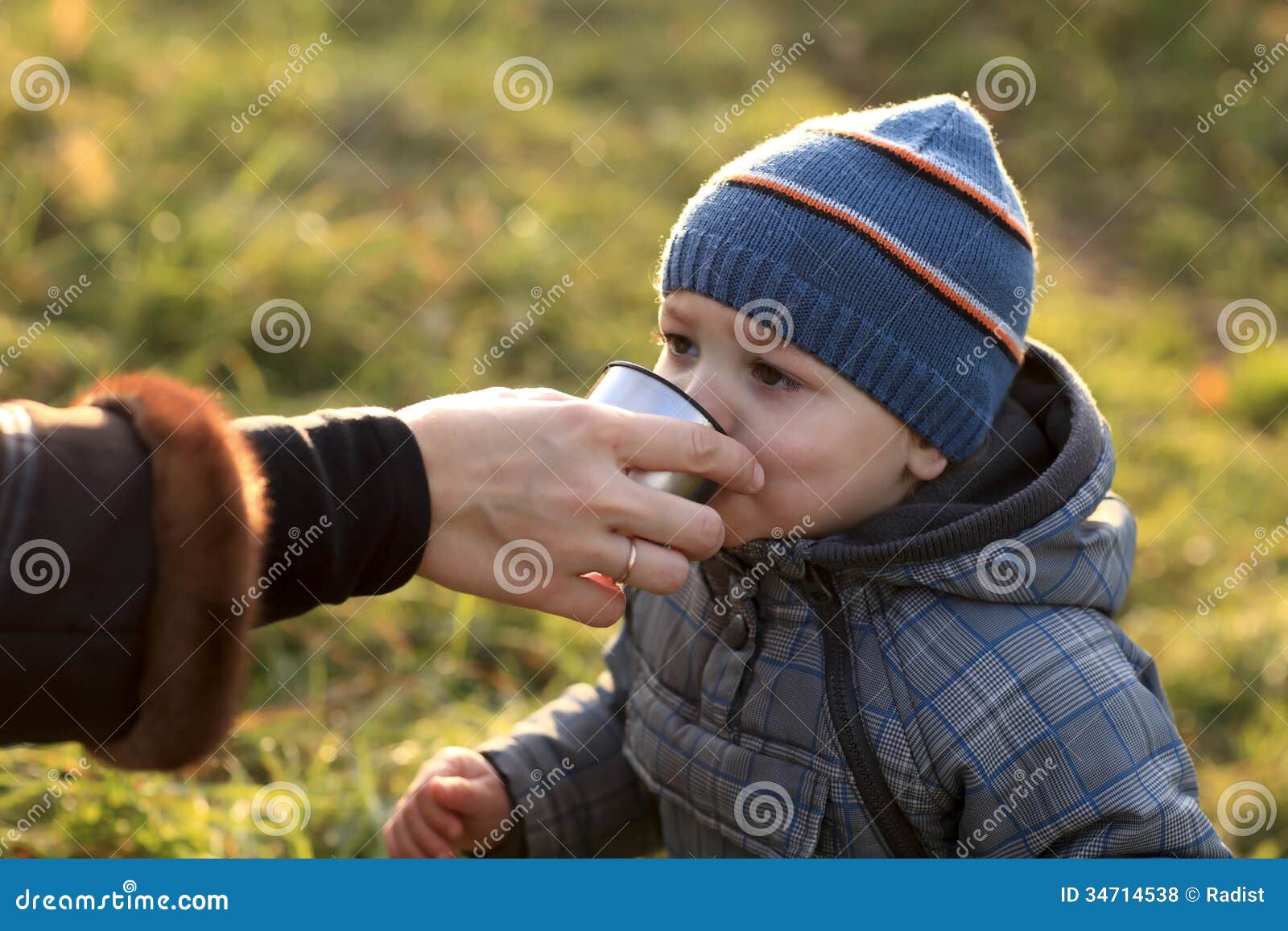 Child drinks tea stock photo. Image of healthy, grass - 34714538