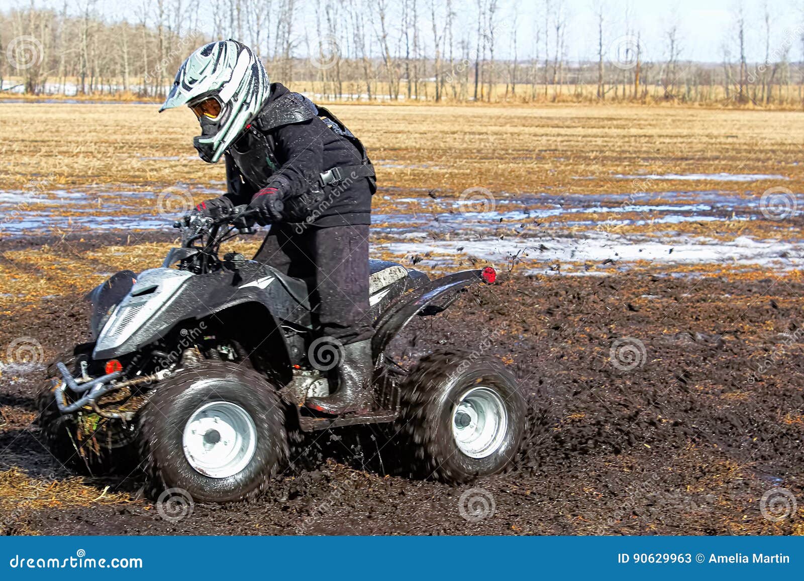 Child Driving through Mud on His Quad Stock Image - Image of ride ...