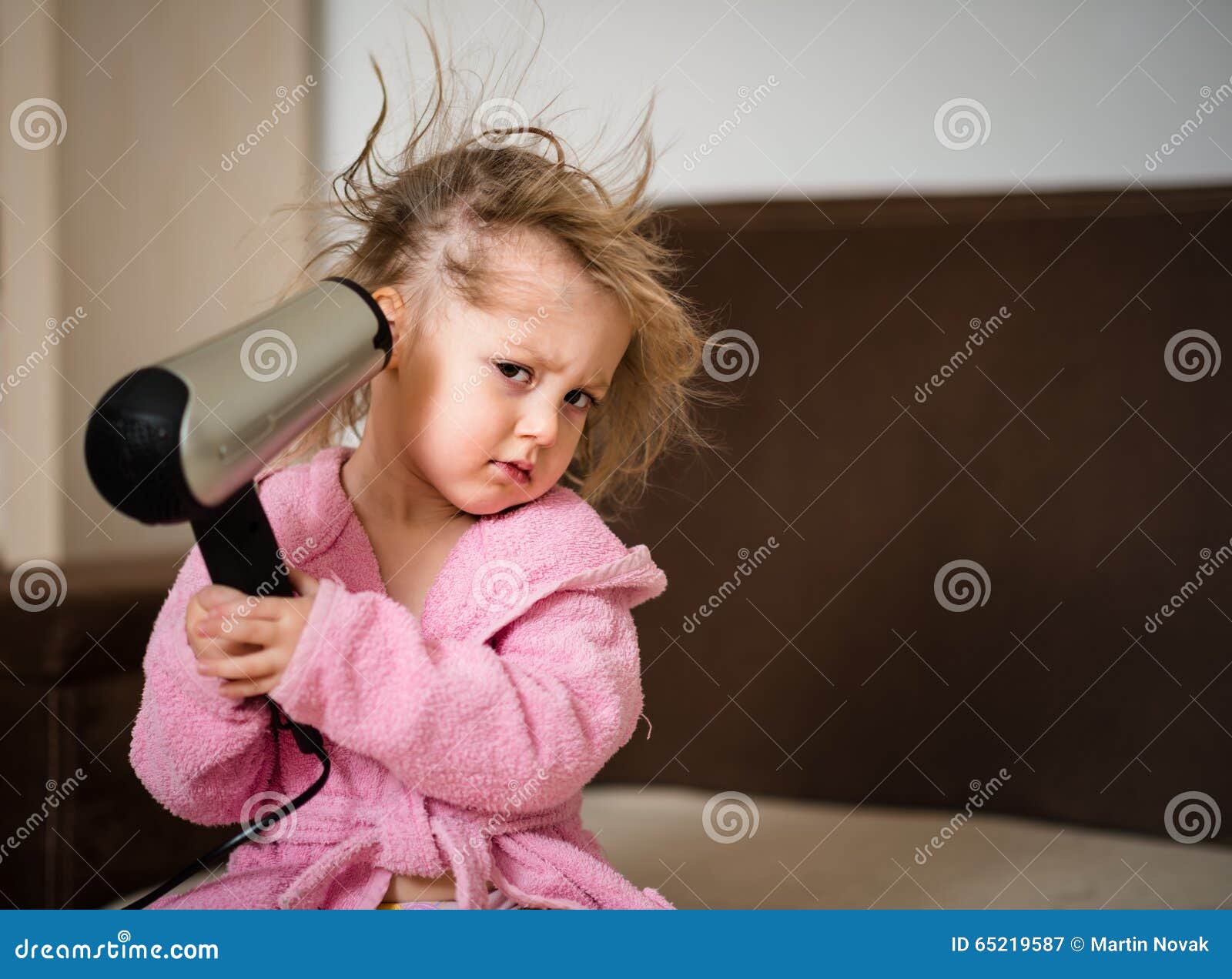 Child drying hair herself stock image. Image of mood - 65219587