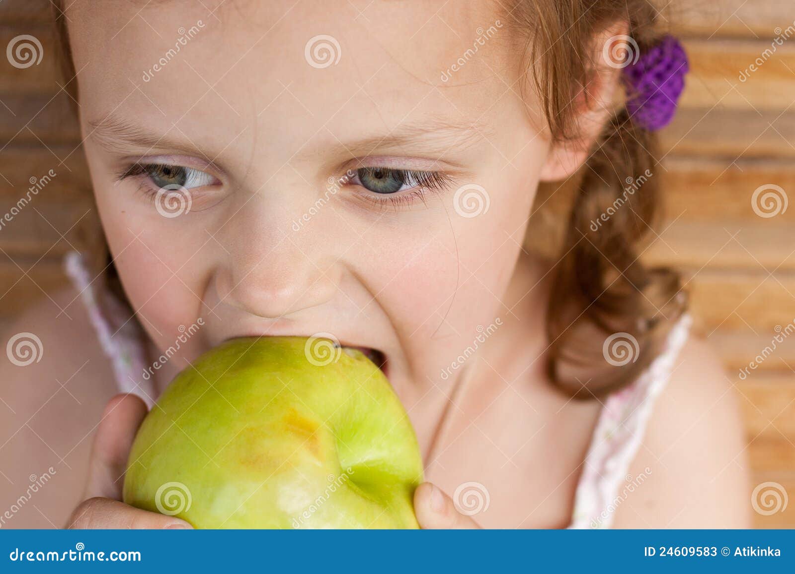 Child eating an apple stock image. Image of kids, summertime - 24609583