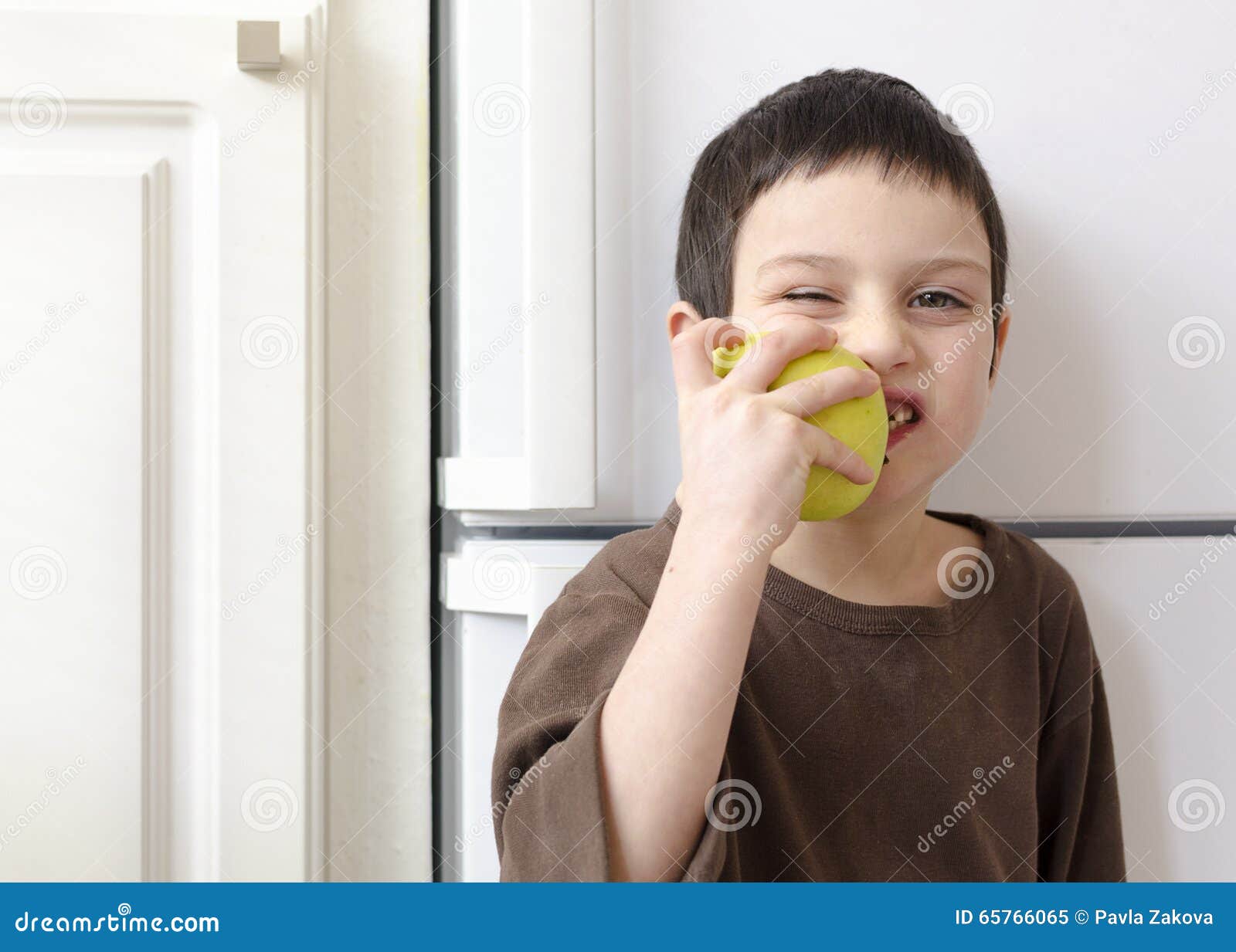 Child eating apple stock image. Image of cute, kitchen - 65766065