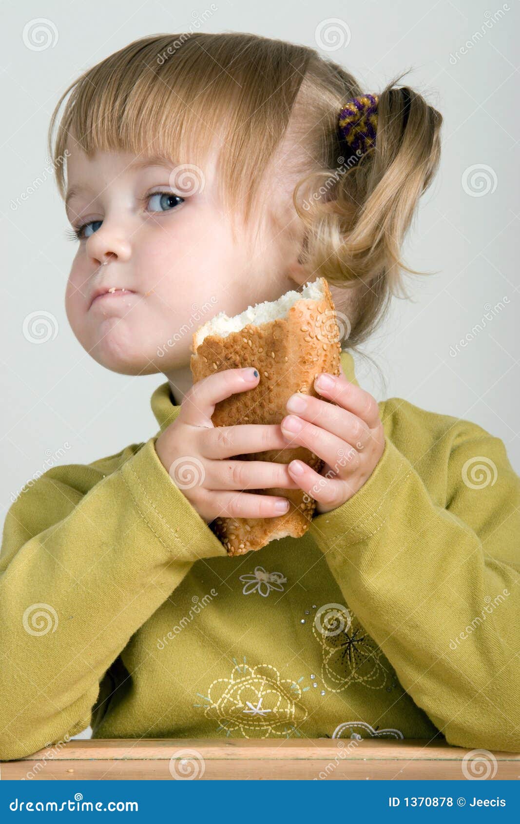 Child eating bread stock photo. Image of divide, casual - 1370878