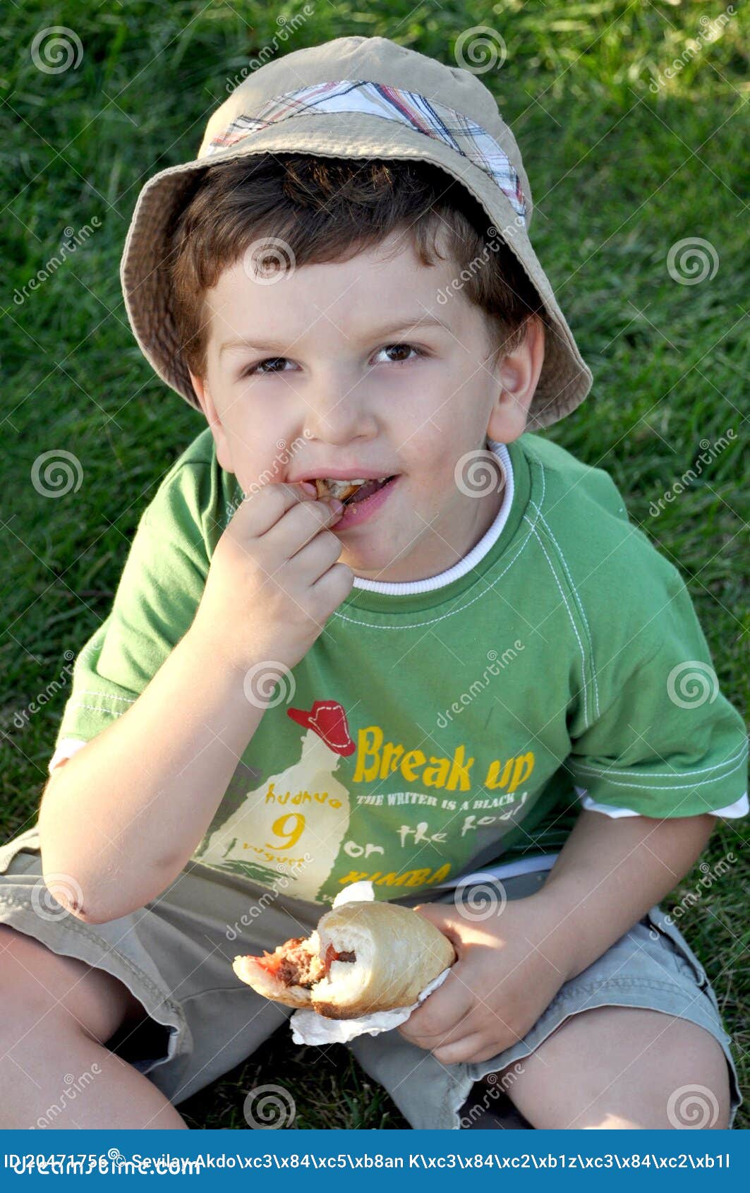Child eating bread stock photo. Image of outside, biting - 20471756