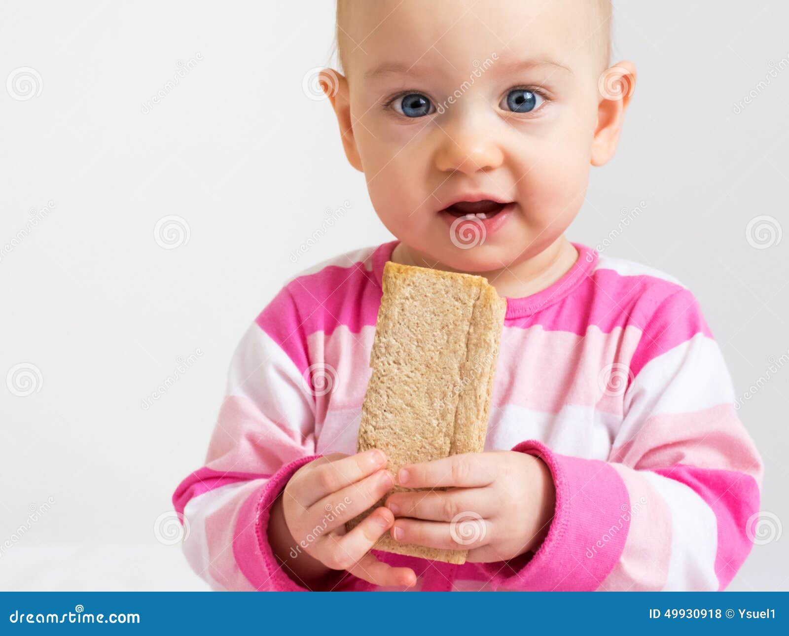Child eating bread stock photo. Image of human, biscuit - 49930918