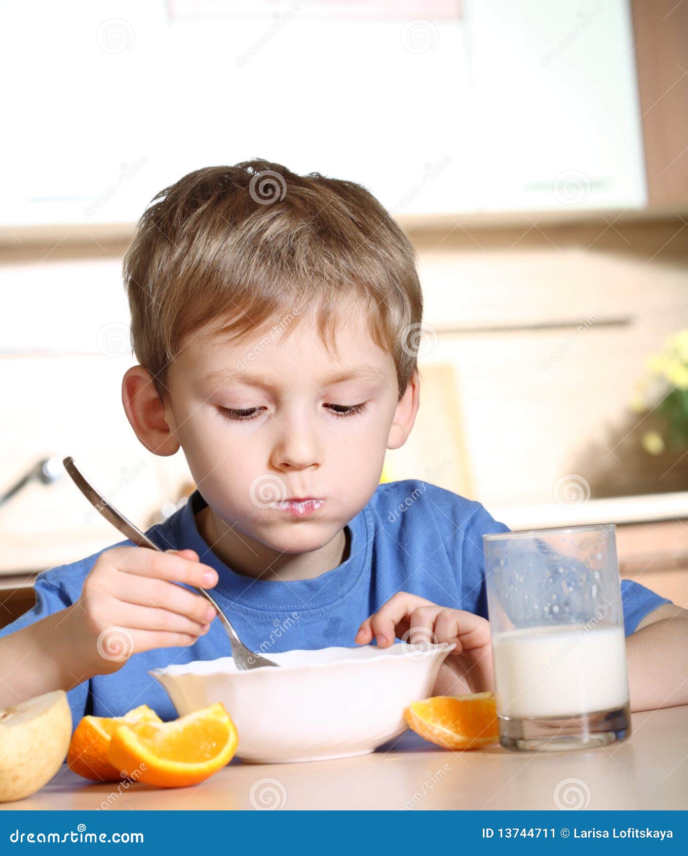 Child Eating Breakfast Stock Image - Image: 13744711